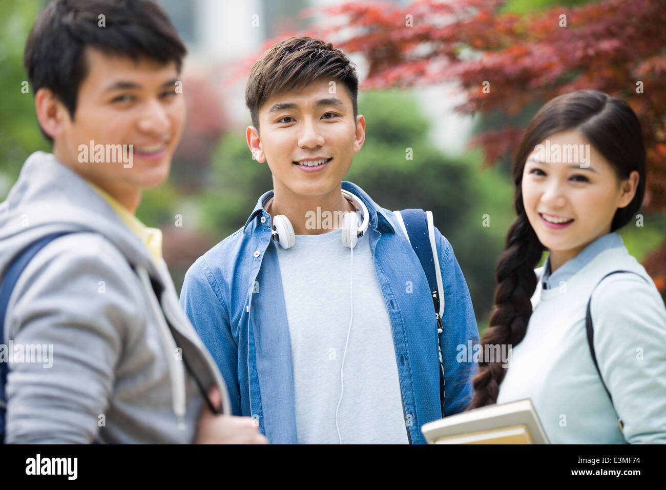 Happy college students on campus Stock Photo - Alamy