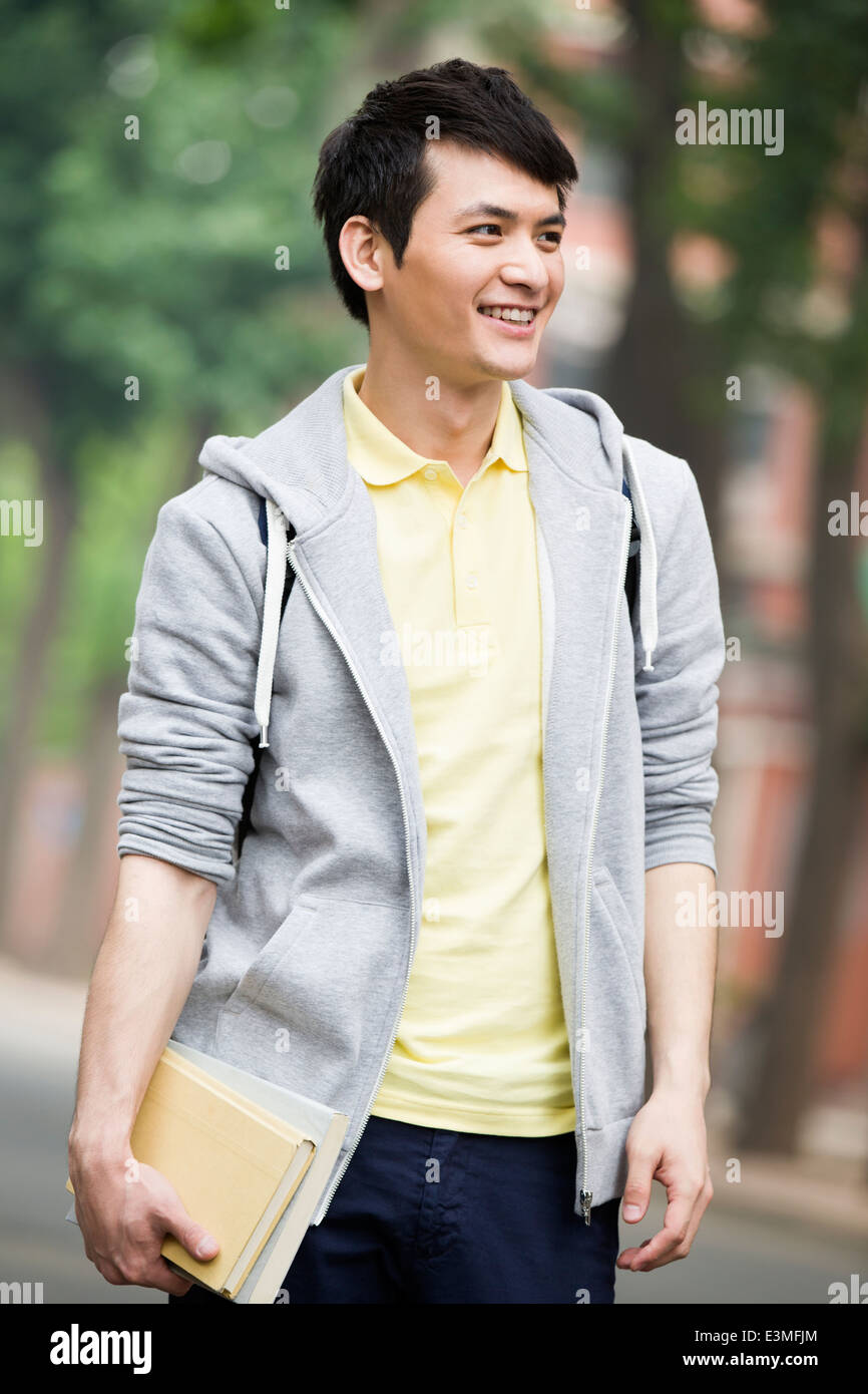 Male college student on campus Stock Photo - Alamy