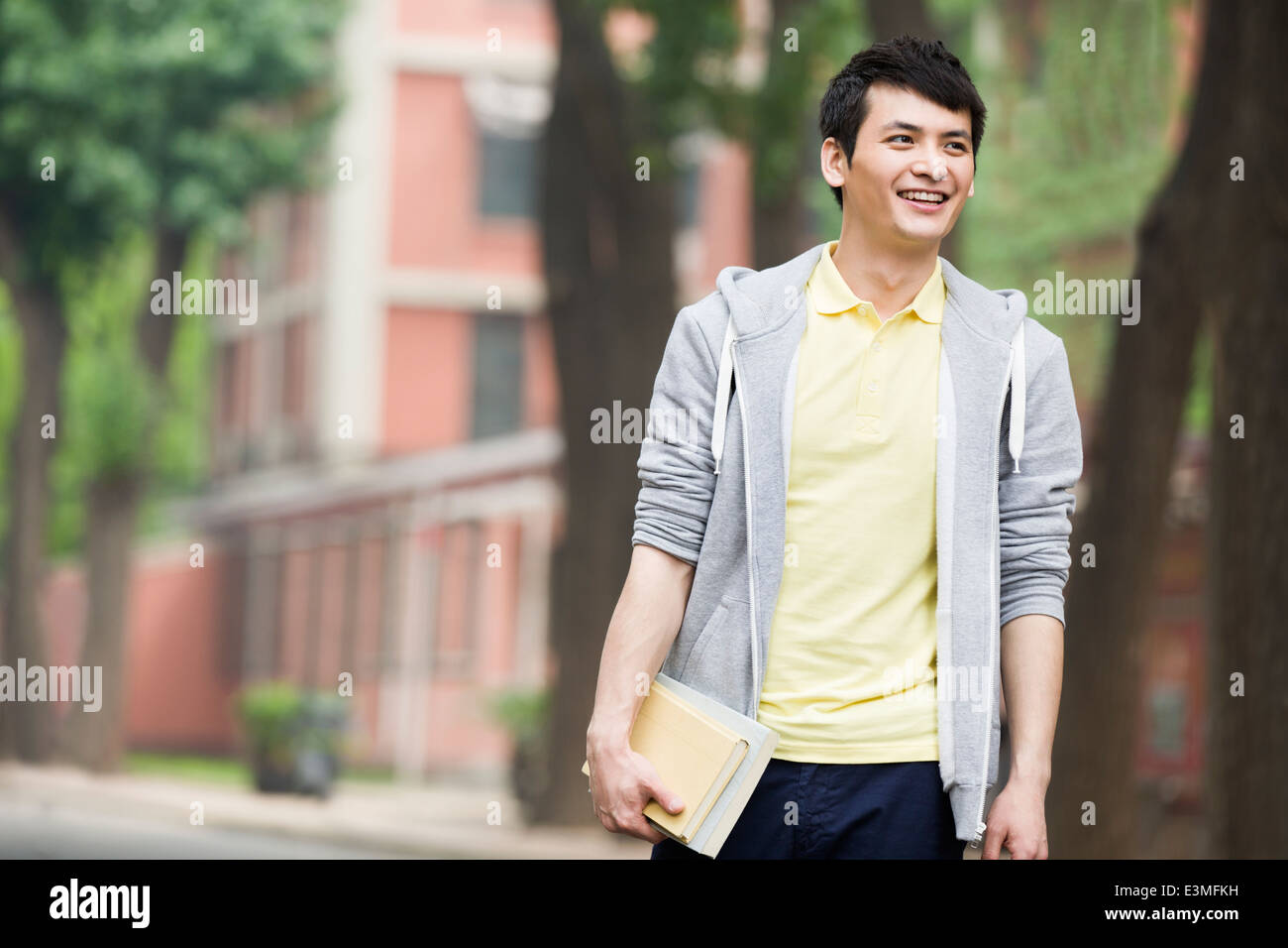 Male college student on campus Stock Photo - Alamy