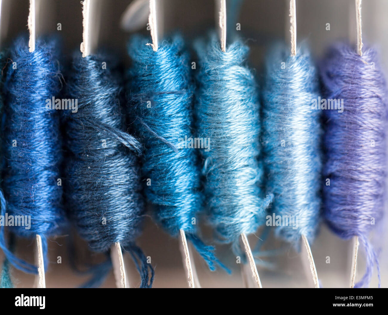 Assorted blue threads background Stock Photo - Alamy