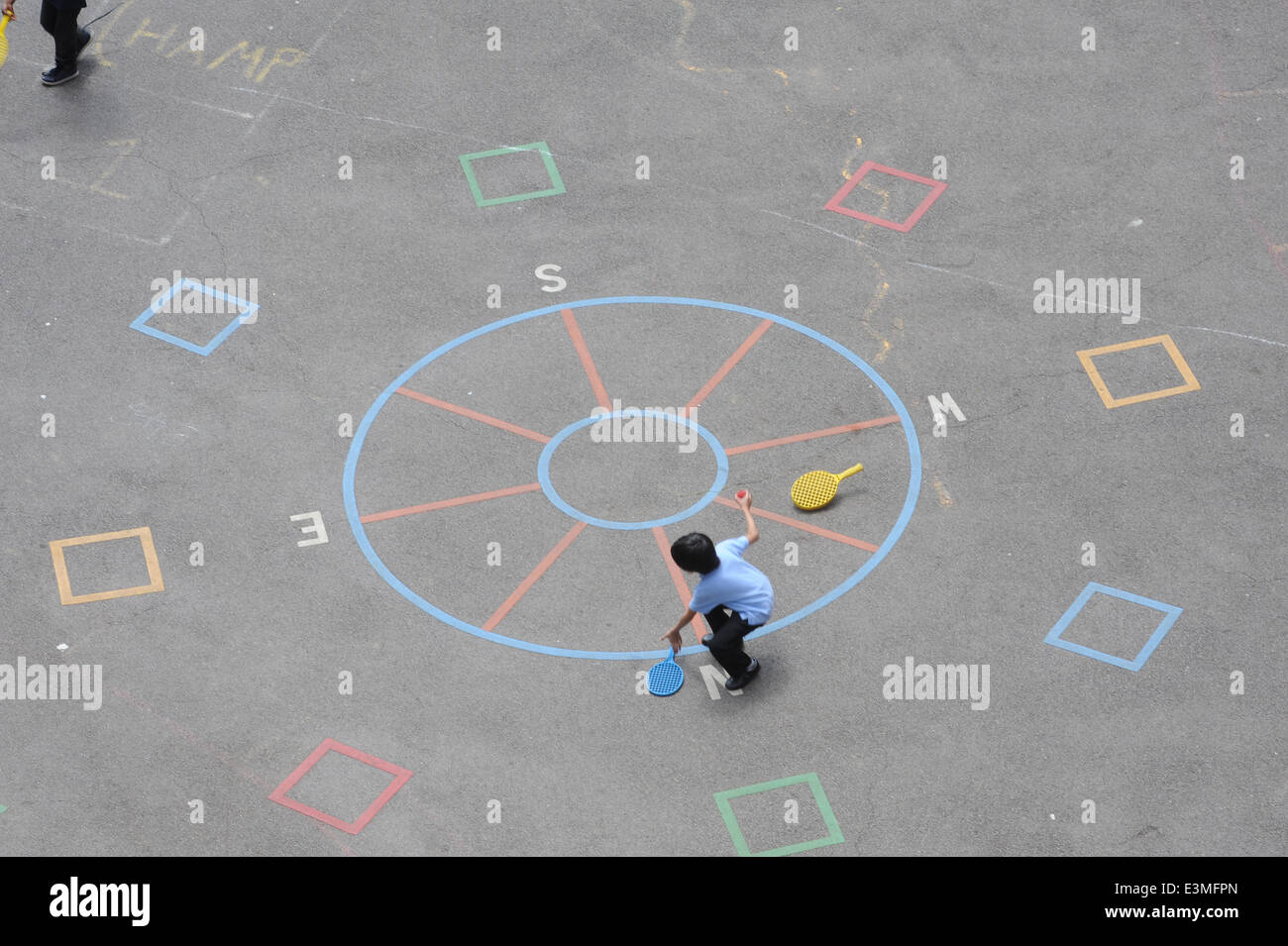School children playing in a school playground in an inner city london ...
