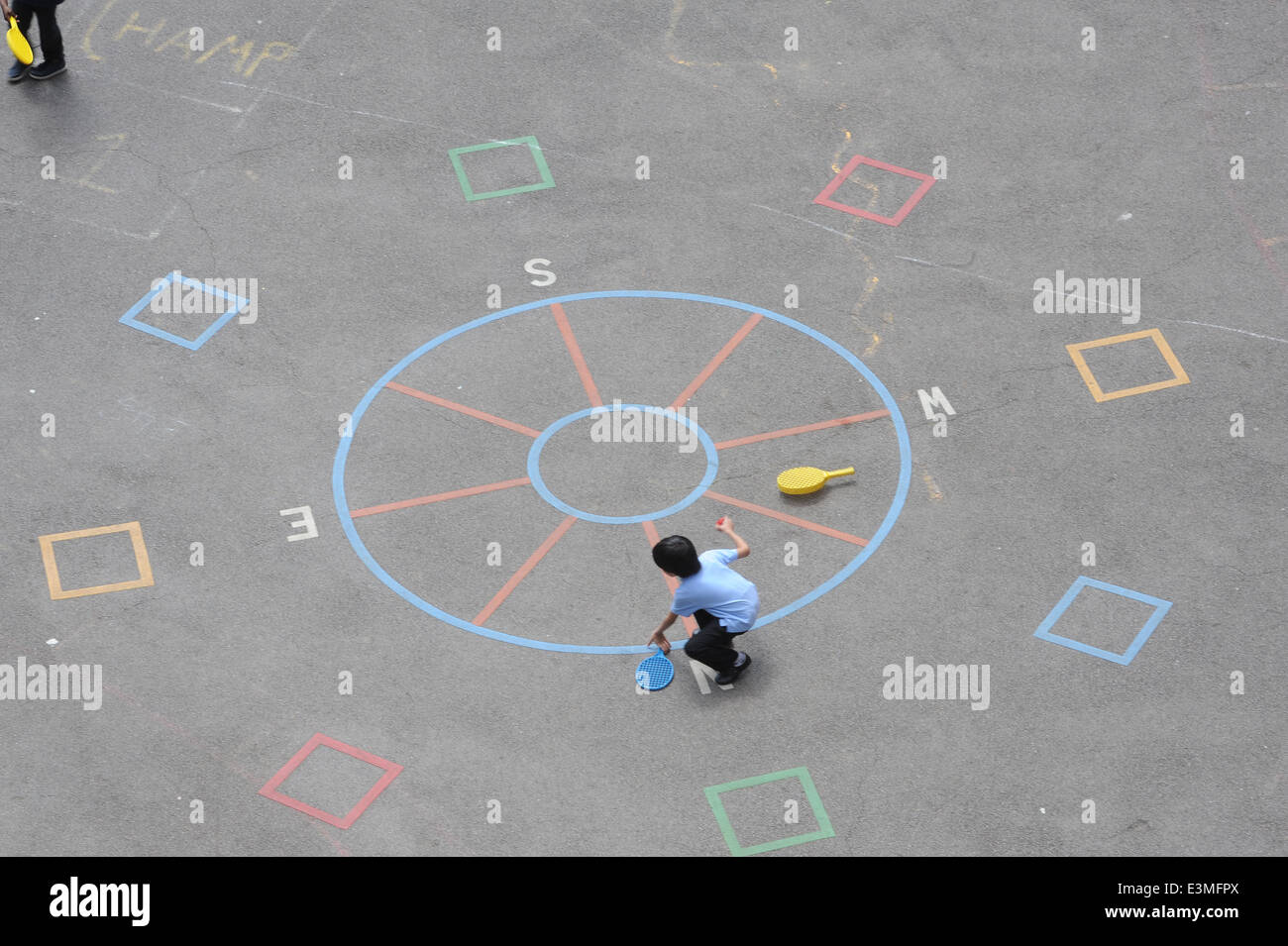 School children playing in a school playground in an inner city london ...