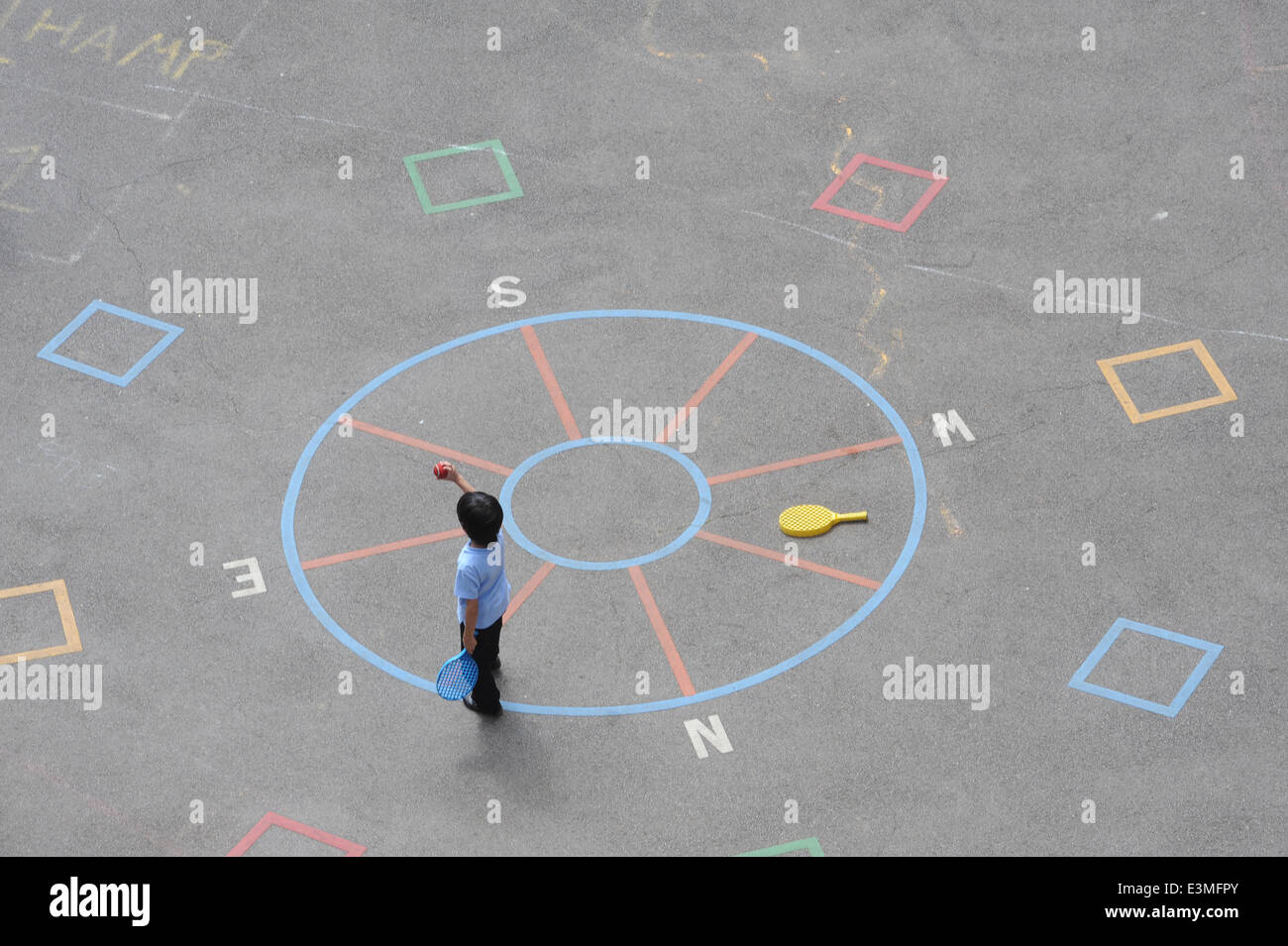 School children playing in a school playground in an inner city london ...