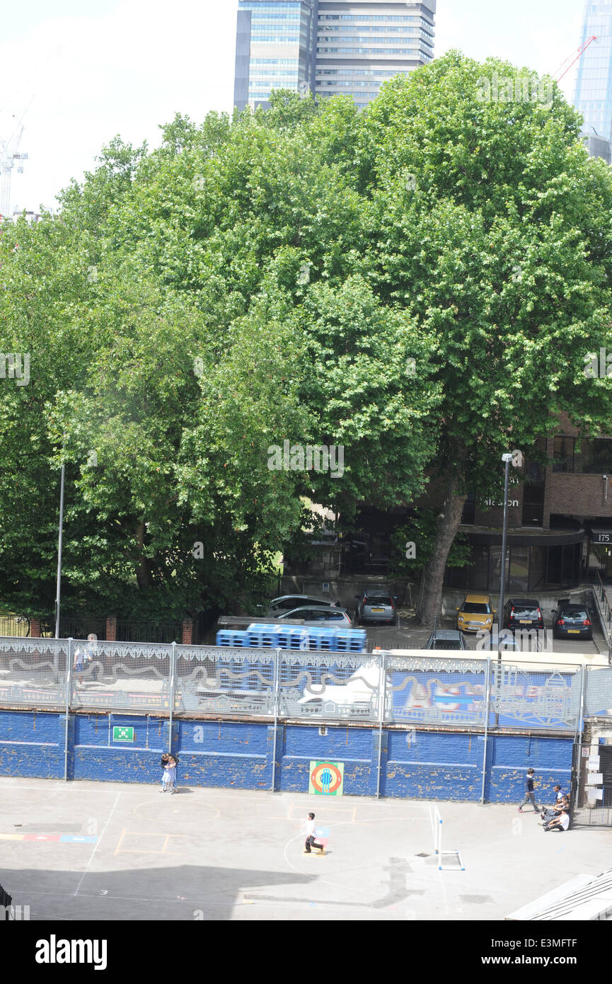 School children playing in a school playground in an inner city london ...