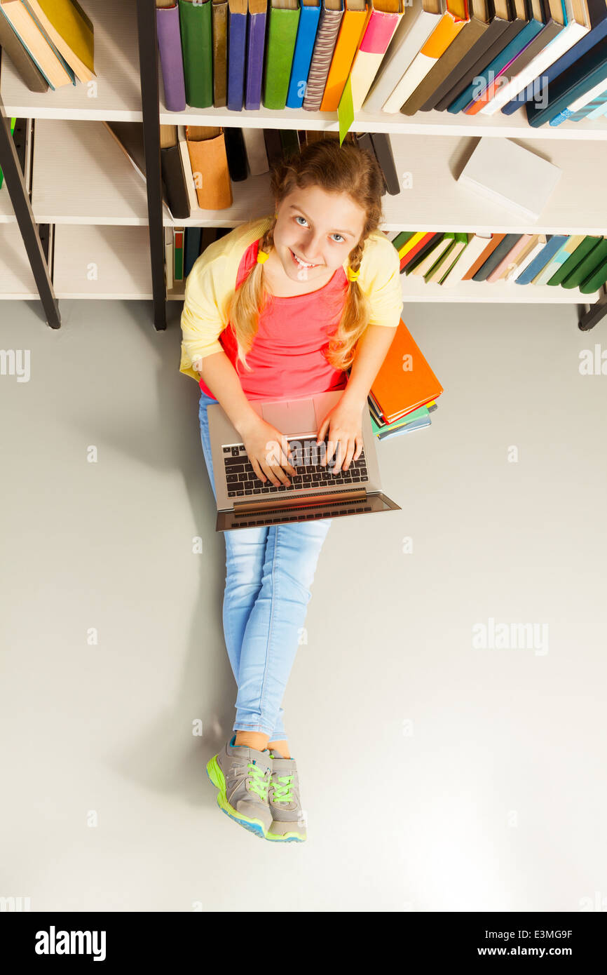 Portrait from above of smiling girl with laptop Stock Photo - Alamy