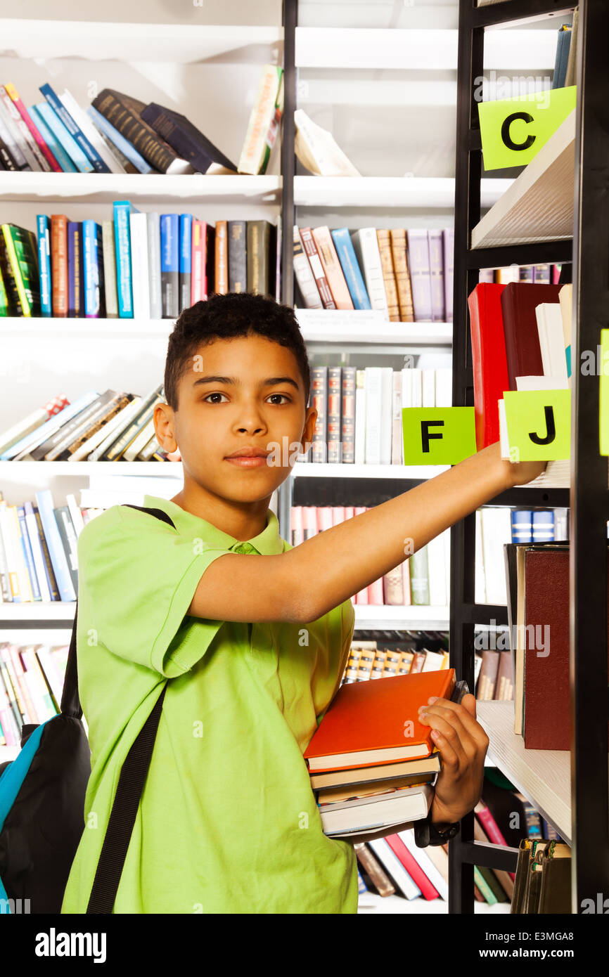 African schoolboy reading book hi-res stock photography and images - Alamy
