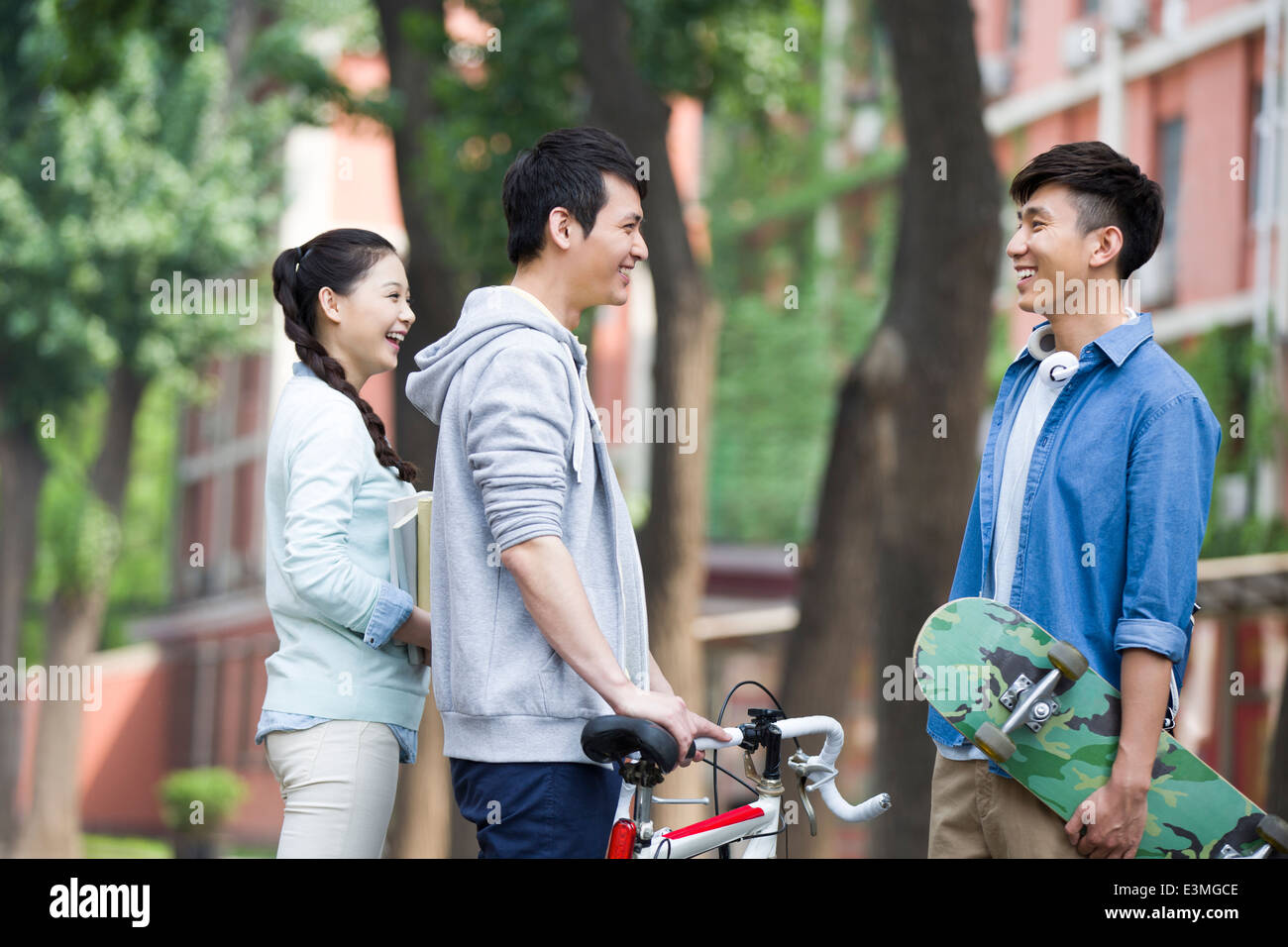 Happy college students on campus Stock Photo - Alamy