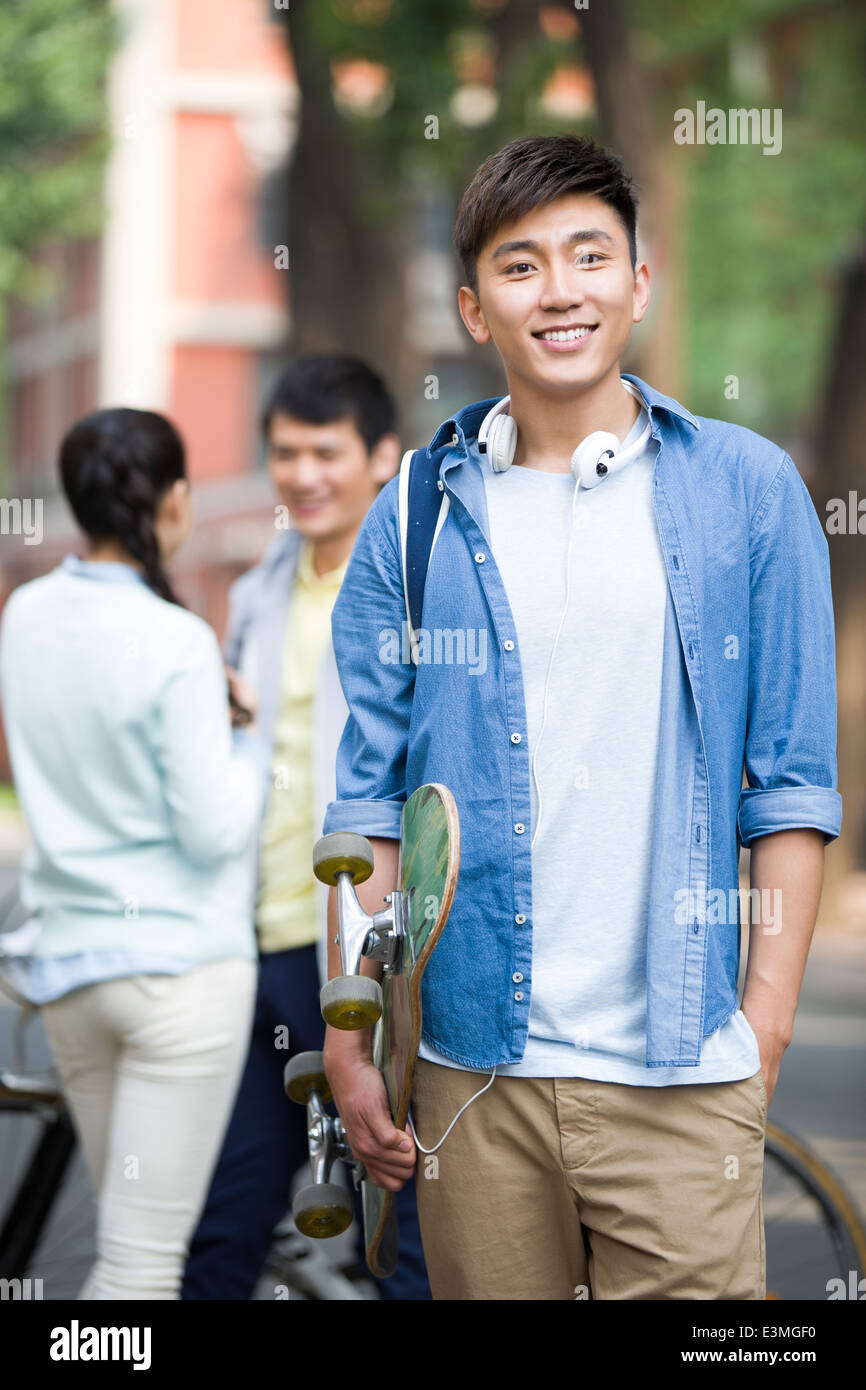 Happy college students on campus Stock Photo - Alamy