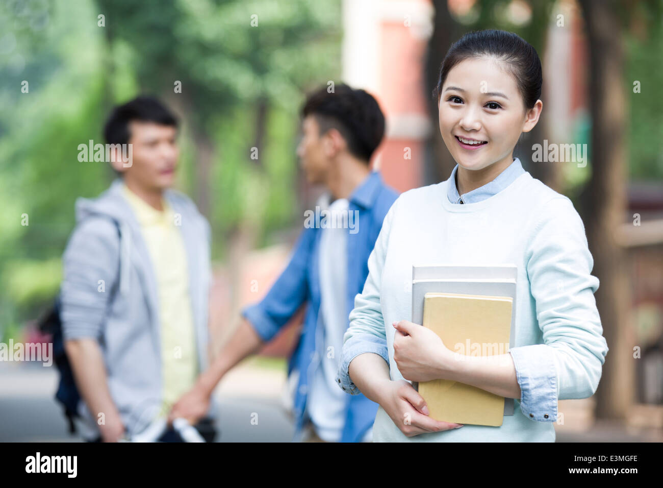 Happy college students on campus Stock Photo - Alamy