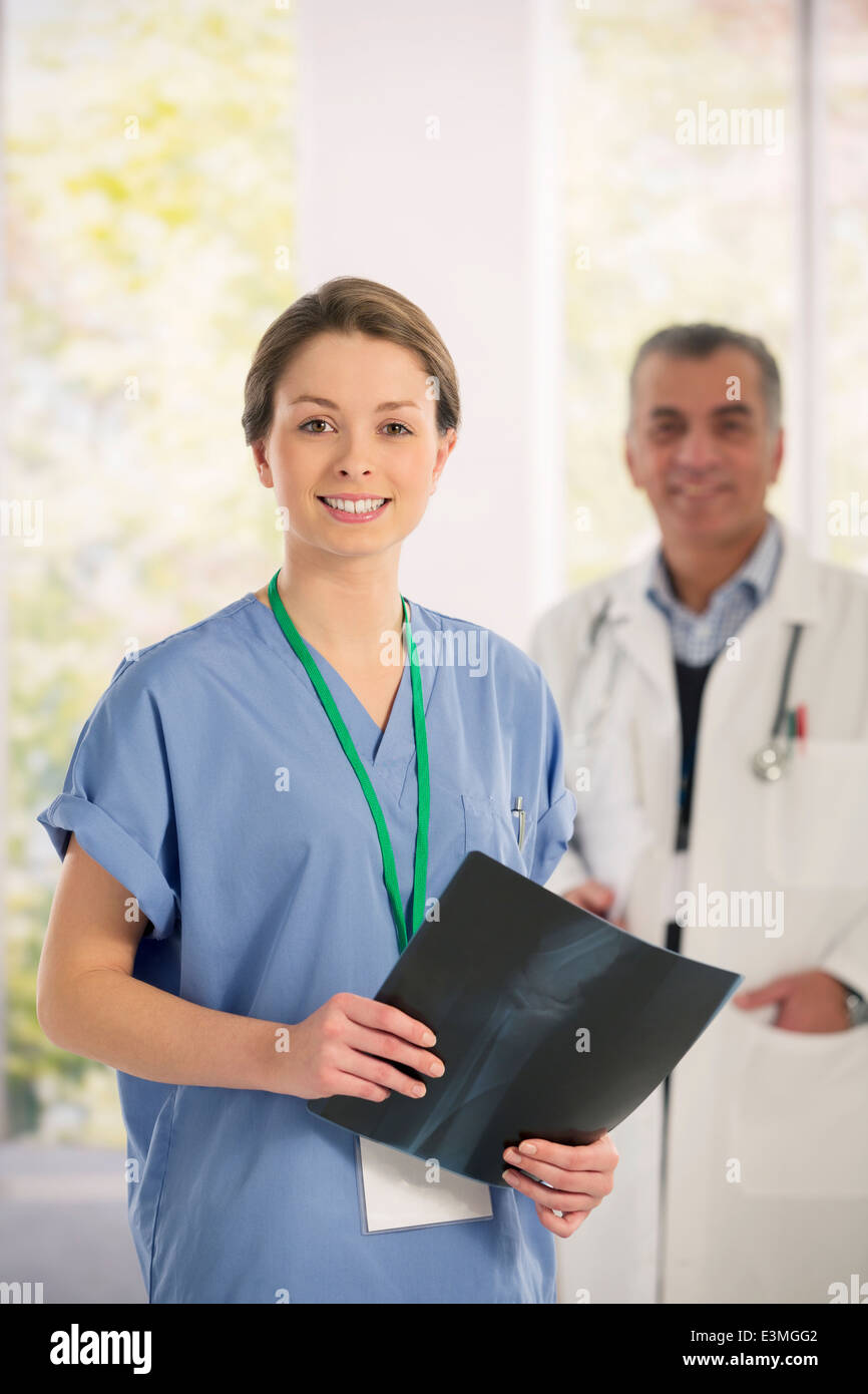 Portrait of confident nurse with x-ray Stock Photo - Alamy