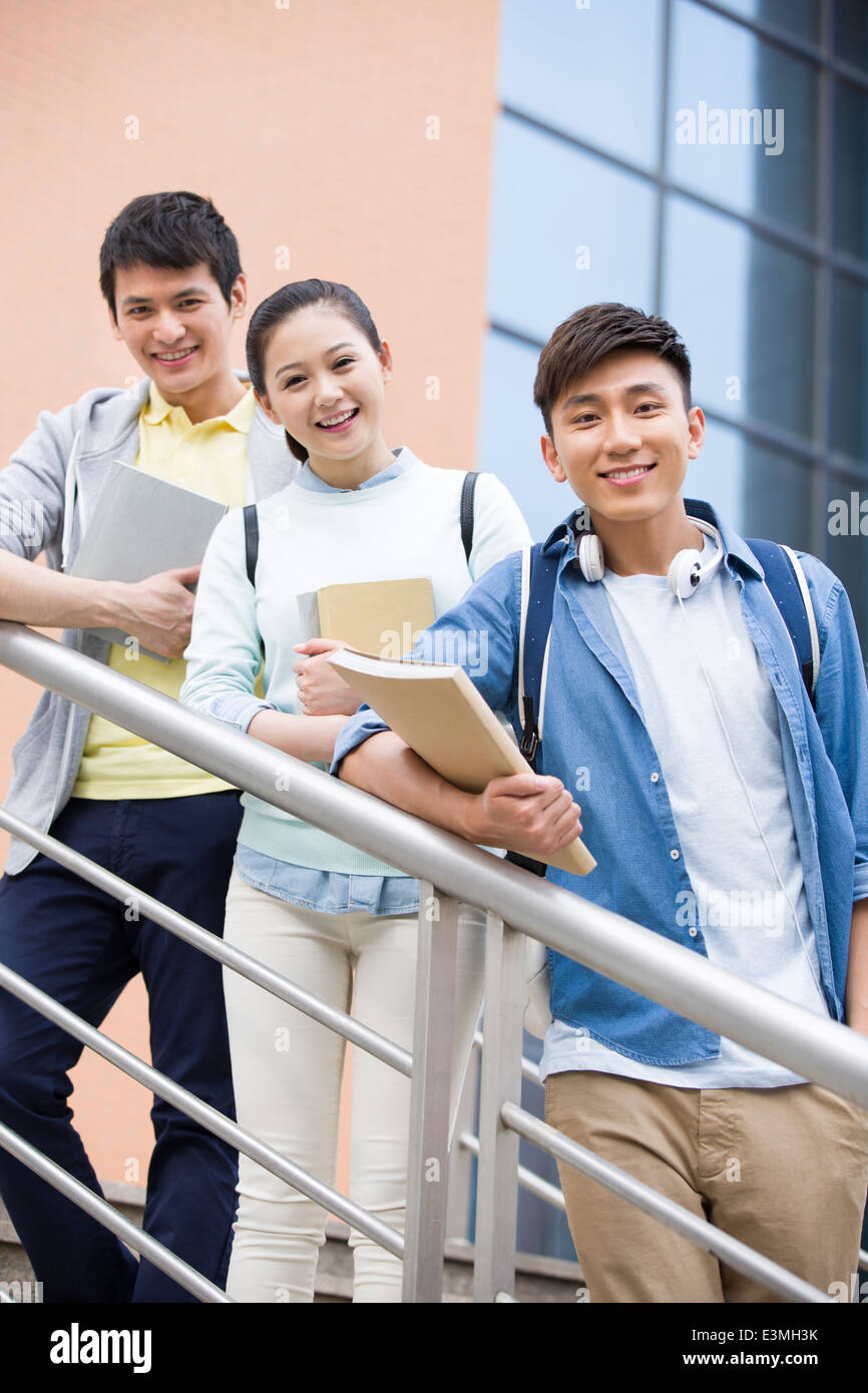 Young college students outside library Stock Photo - Alamy