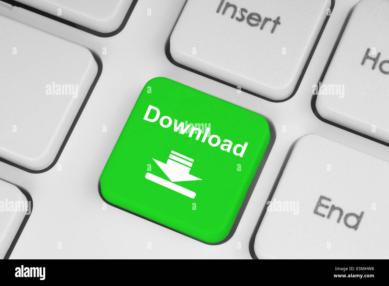 Green download keyboard button close-up Stock Photo - Alamy
