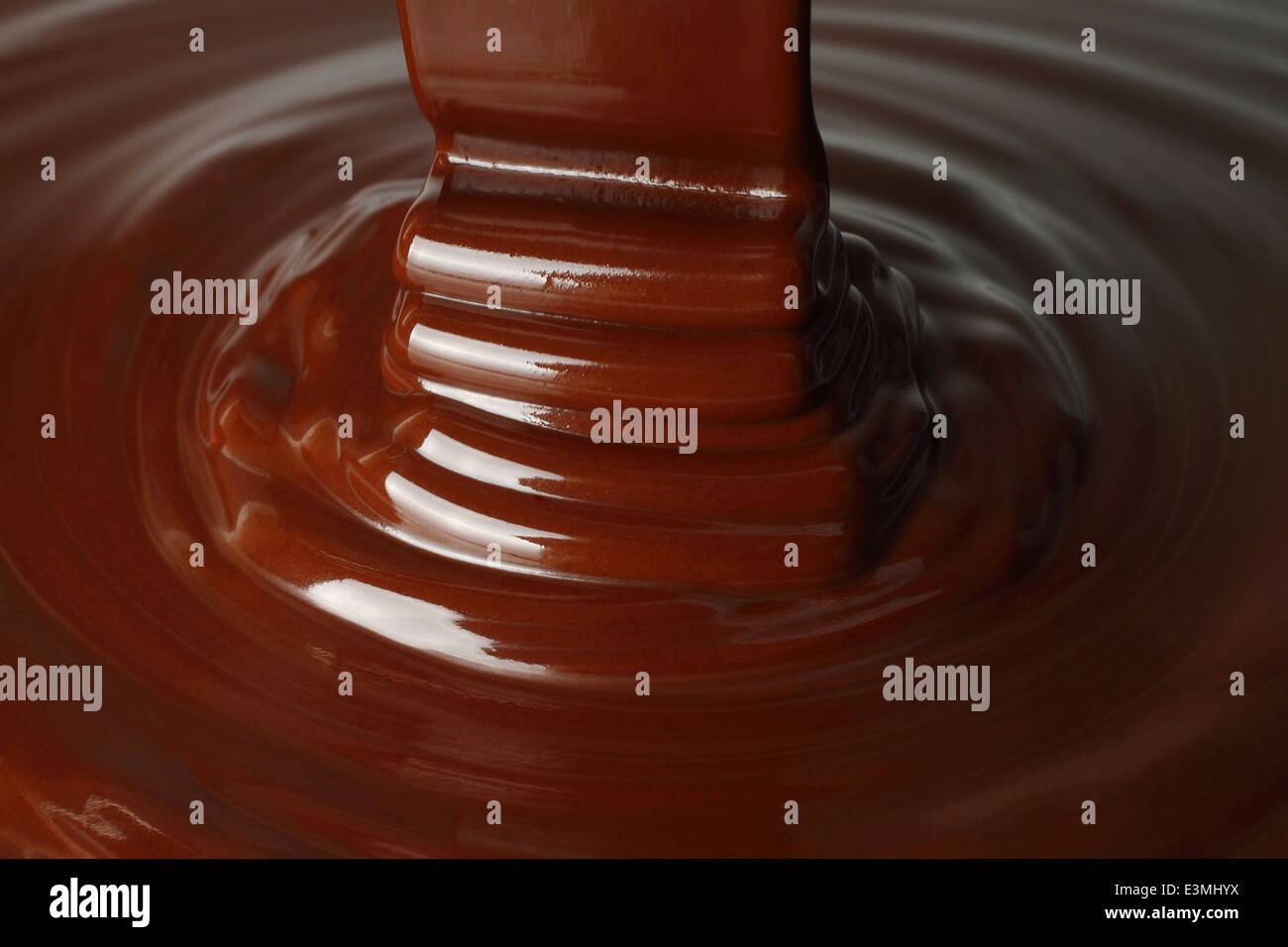 Dark chocolate flow close-up texture Stock Photo - Alamy