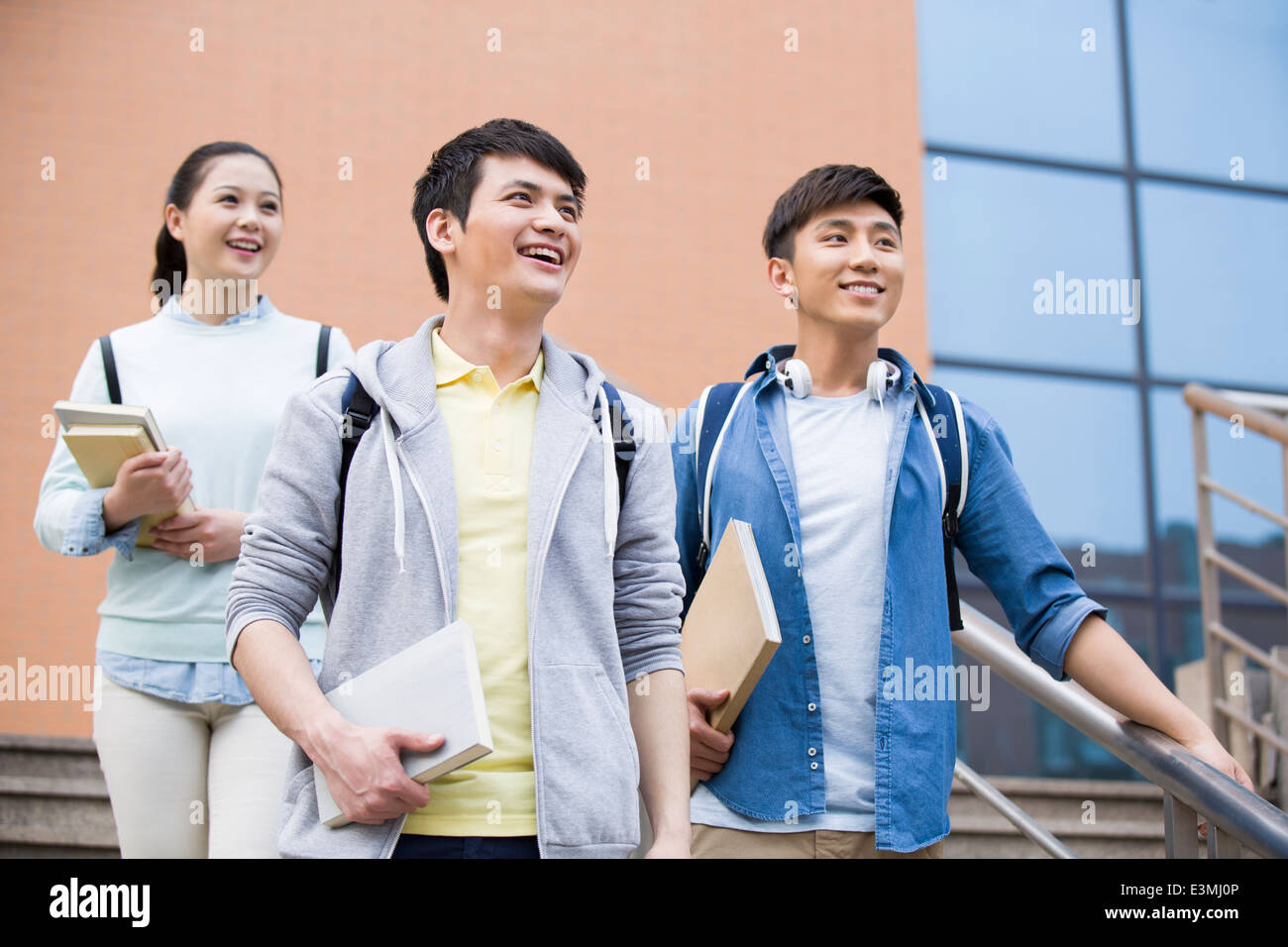 Young college students outside library Stock Photo - Alamy