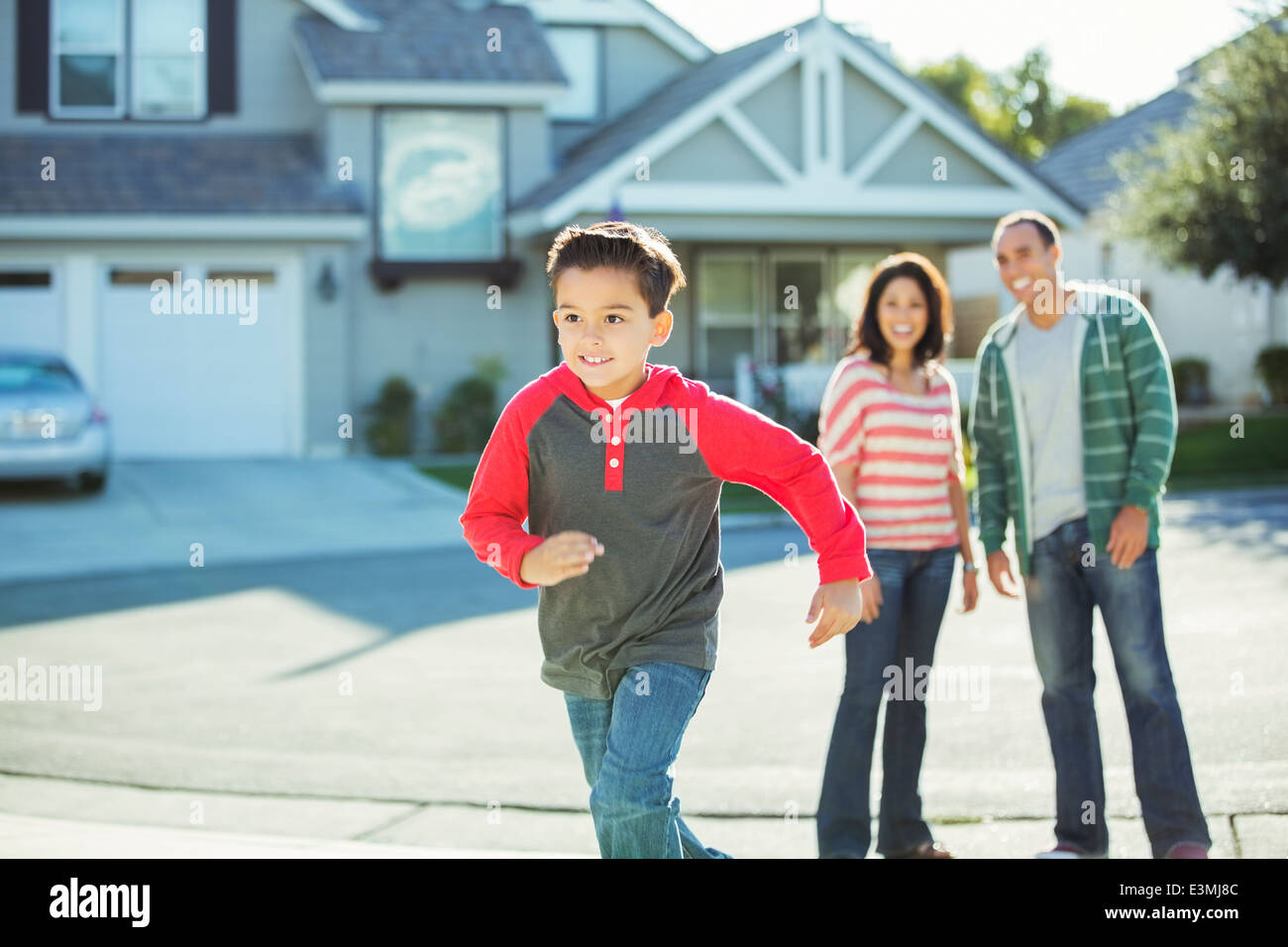 Boy running outdoors Stock Photo - Alamy