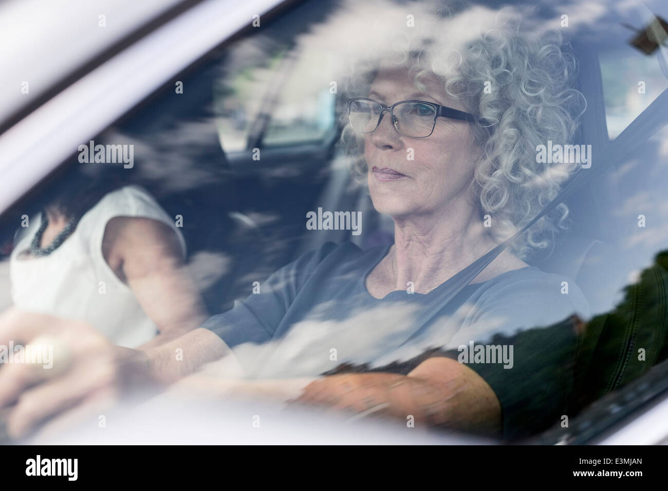 Senior woman driving car Stock Photo - Alamy