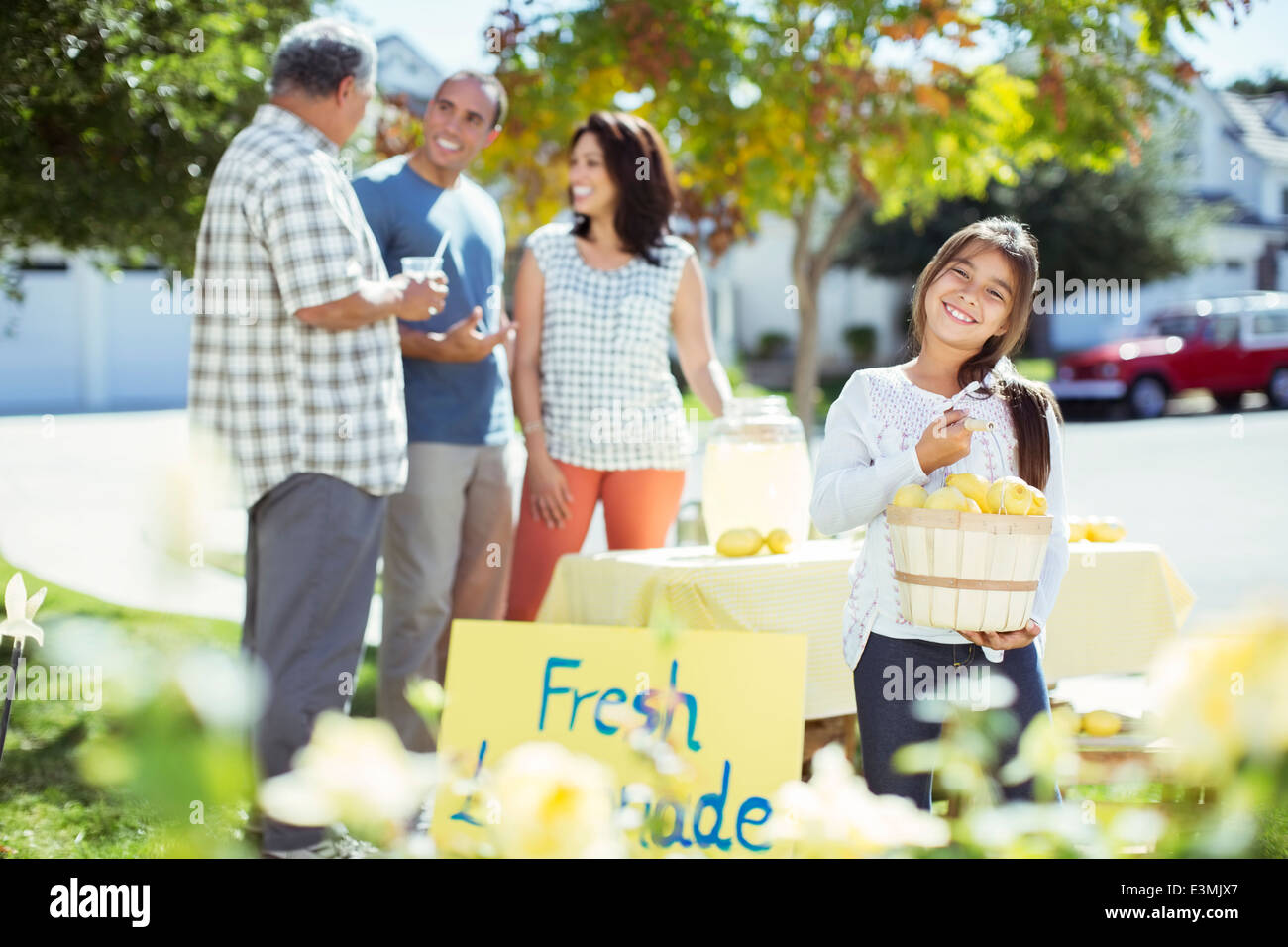 Portrait of smiling girl holding lemons at lemonade stand Stock Photo ...