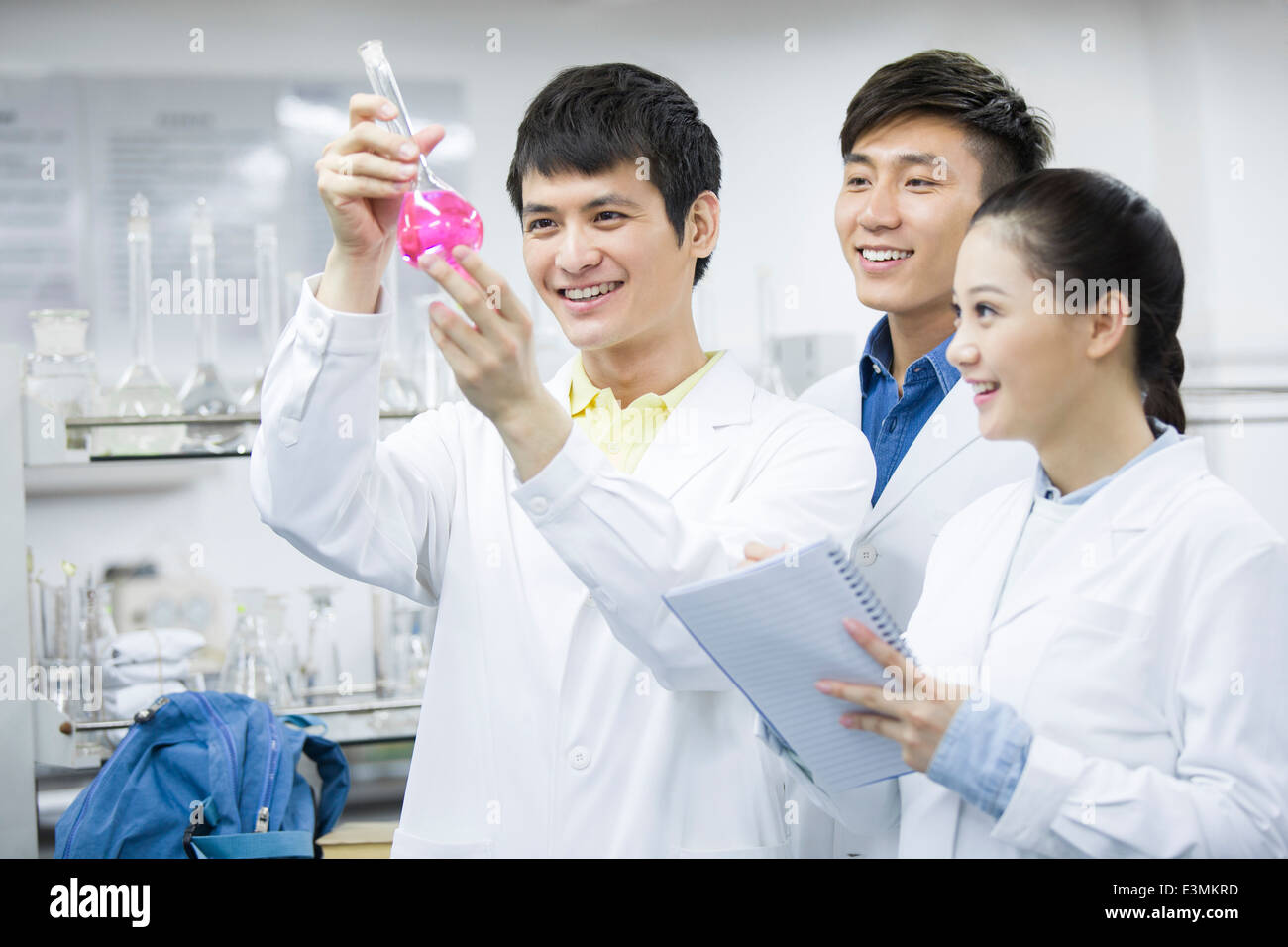 College students doing experiment Stock Photo - Alamy