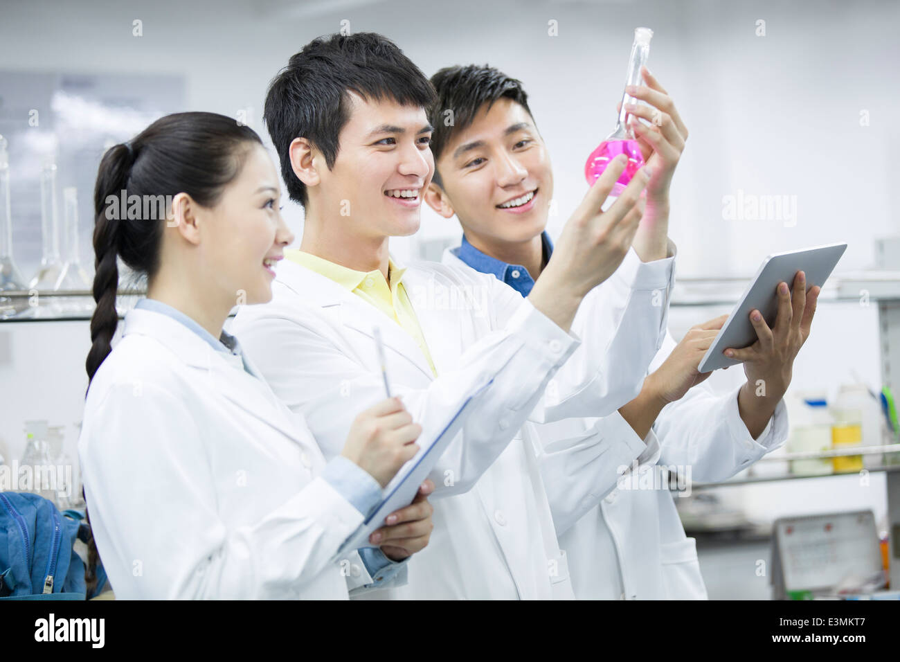 College students doing experiment Stock Photo - Alamy