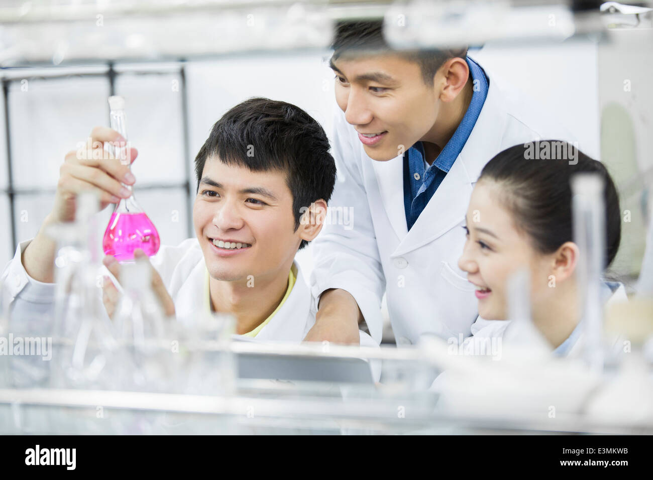 College students doing experiment Stock Photo - Alamy