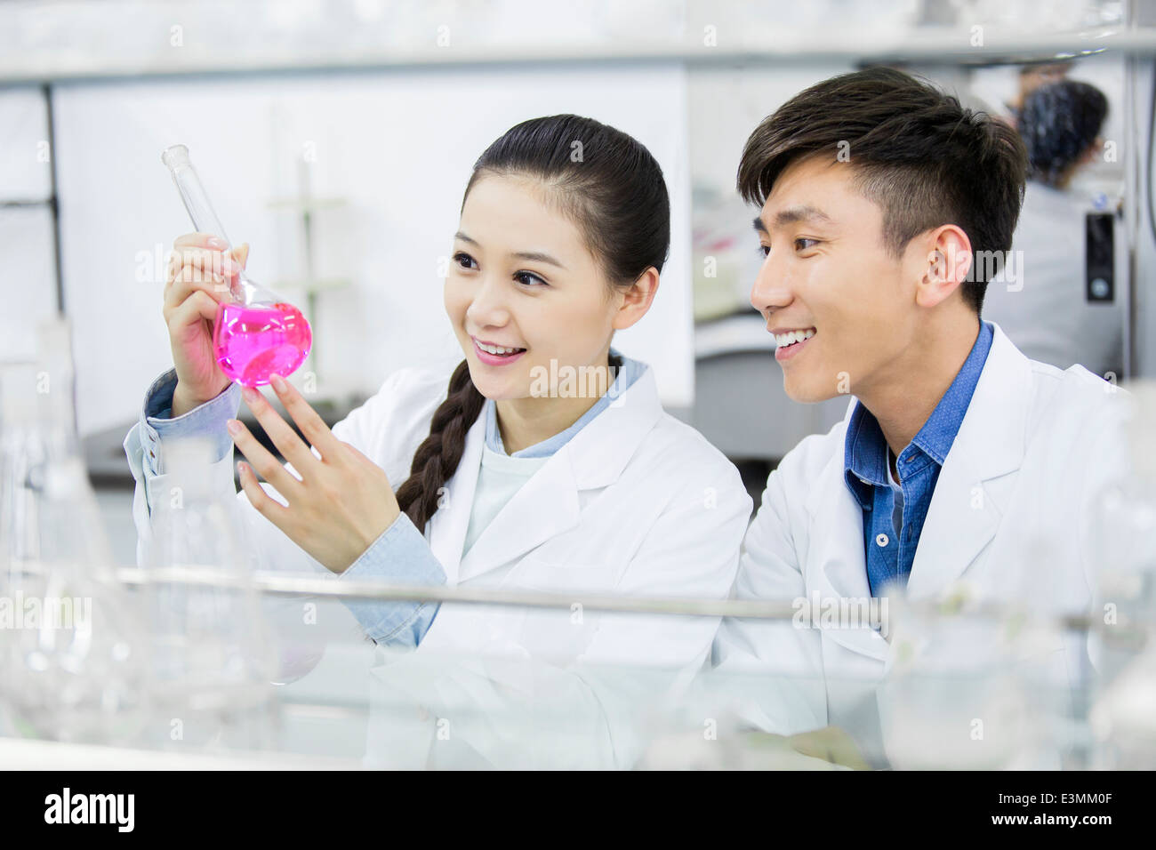 College students doing experiment Stock Photo - Alamy