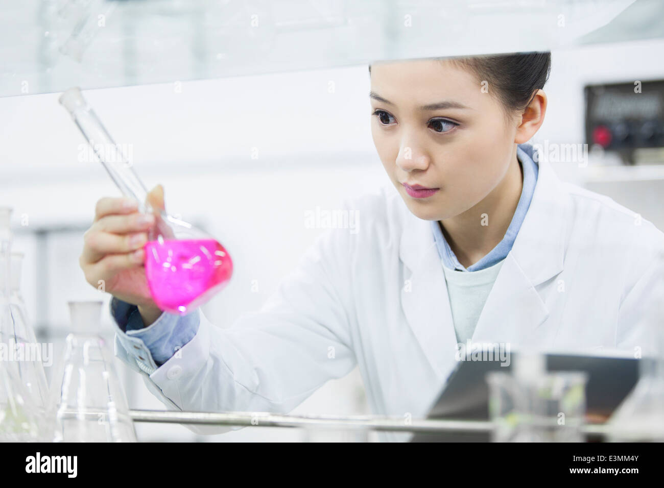 College student doing experiment Stock Photo - Alamy