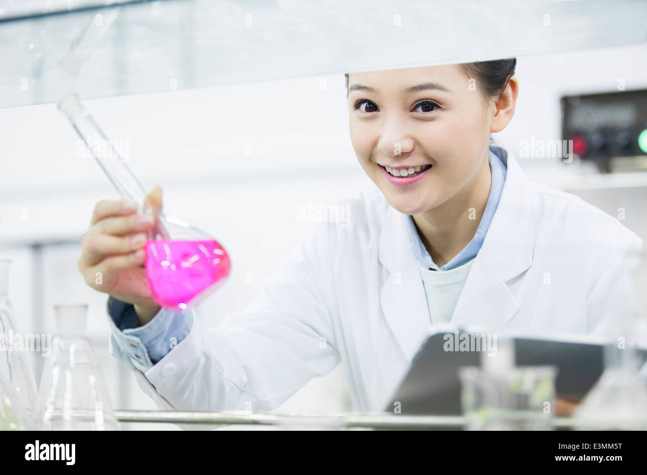 College student doing experiment Stock Photo - Alamy