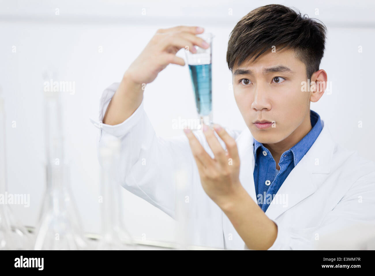 College student doing experiment Stock Photo - Alamy