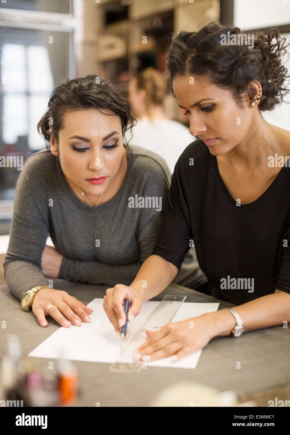 Businesswomen working in office paper hi-res stock photography and ...