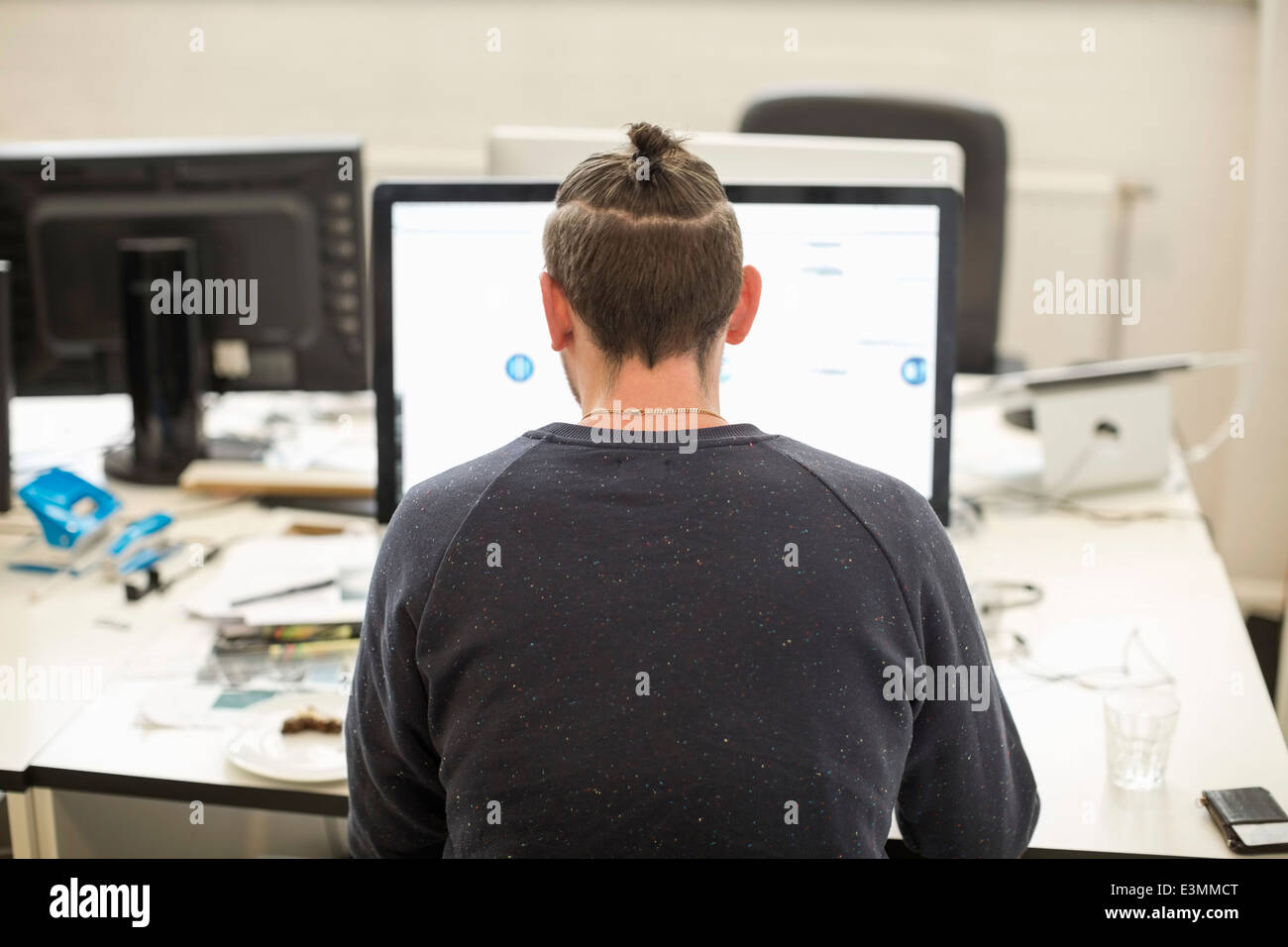 Mature man computer sitting rear view hi-res stock photography and ...