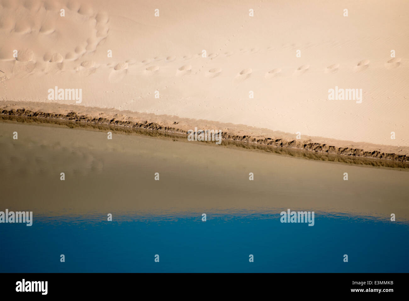 reflecting top of sand dune in calm lagoon water Stock Photo - Alamy