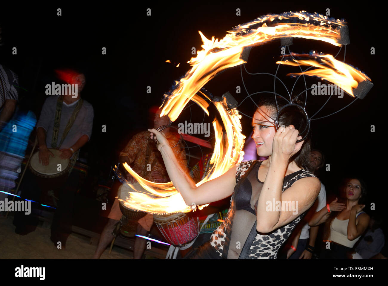 Fire Juggler, dancer performing at a silent disco, beach party at ...