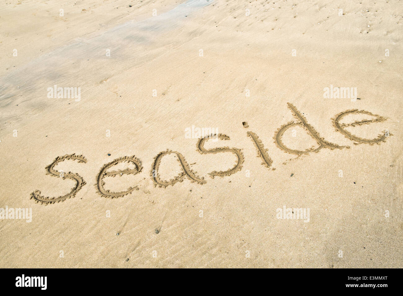 The Word seaside written in sand on a beach Stock Photo - Alamy