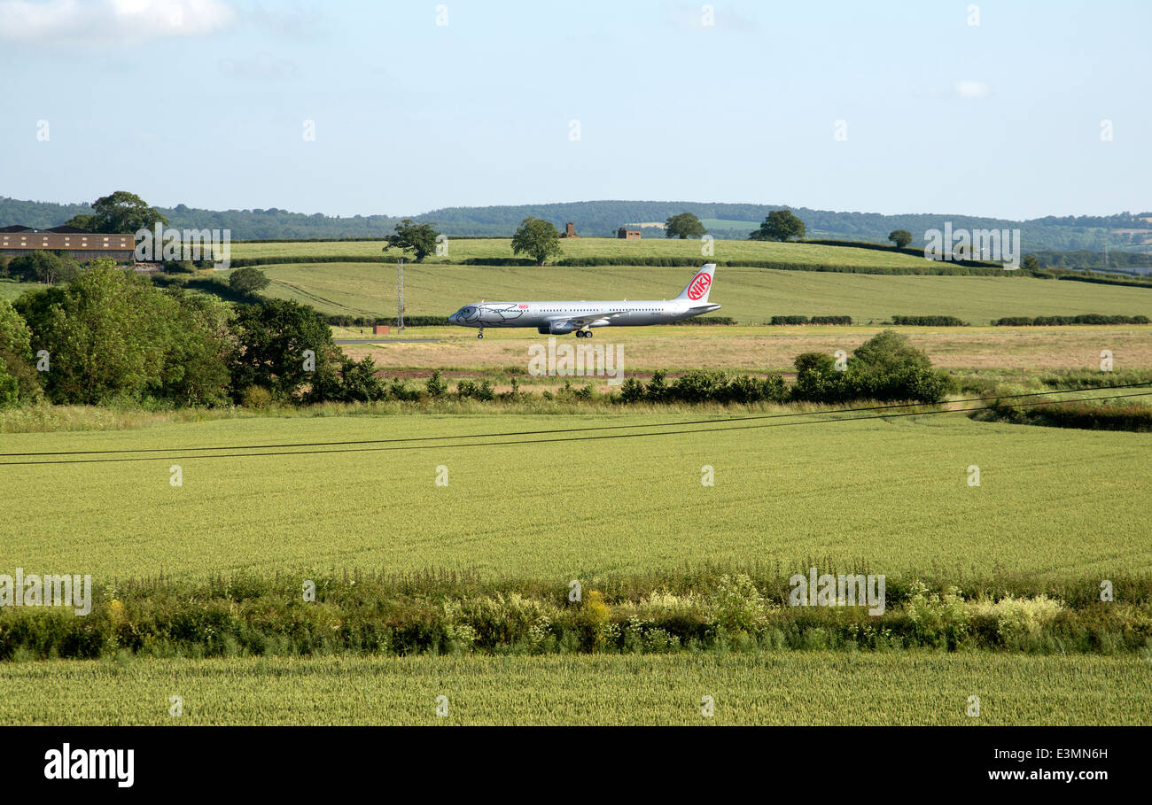 Exeter Airport Devon England UK viewed across farmland a A321 Airbus ...