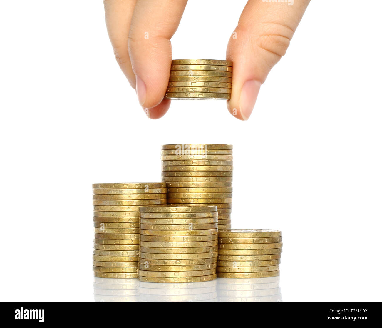 Hand put coins to stack of coins on white background Stock Photo - Alamy