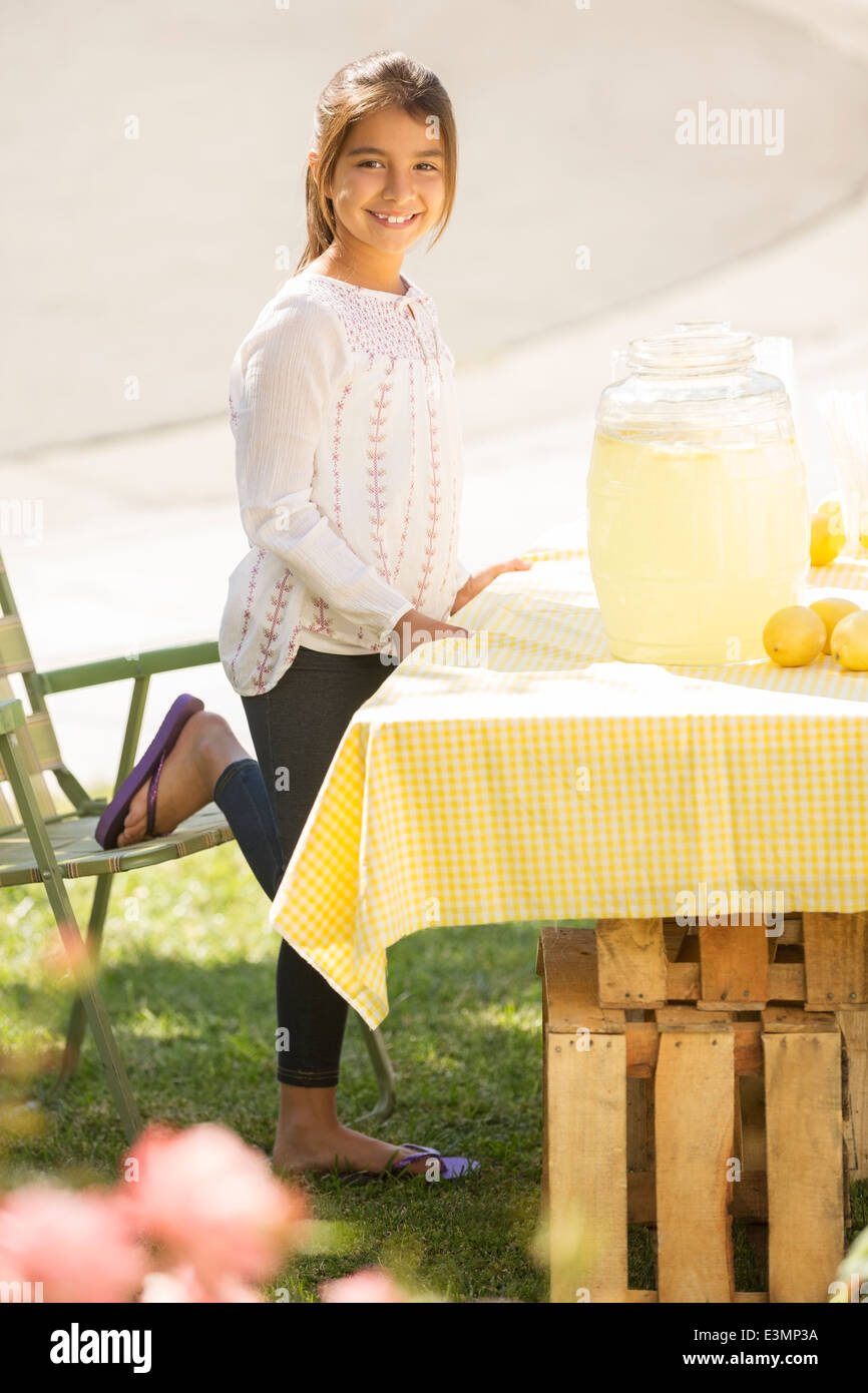 Portrait of smiling girl working lemonade stand Stock Photo - Alamy