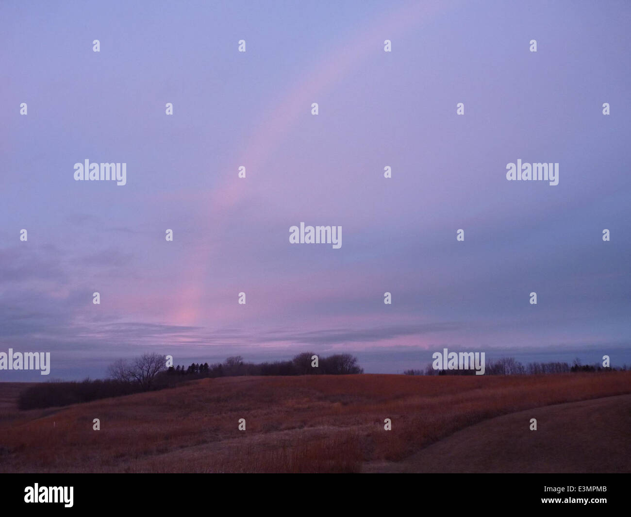 A winter rainbow appears over the Morris Wetland Management District in ...