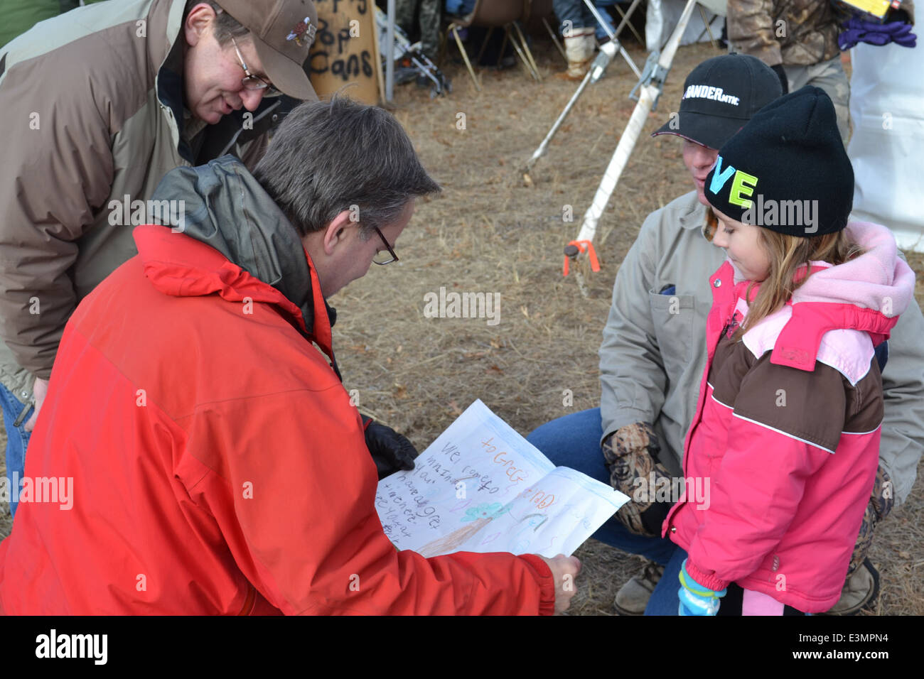 Greg Siekaniec, a key figure in wildlife conservation, reads the ...