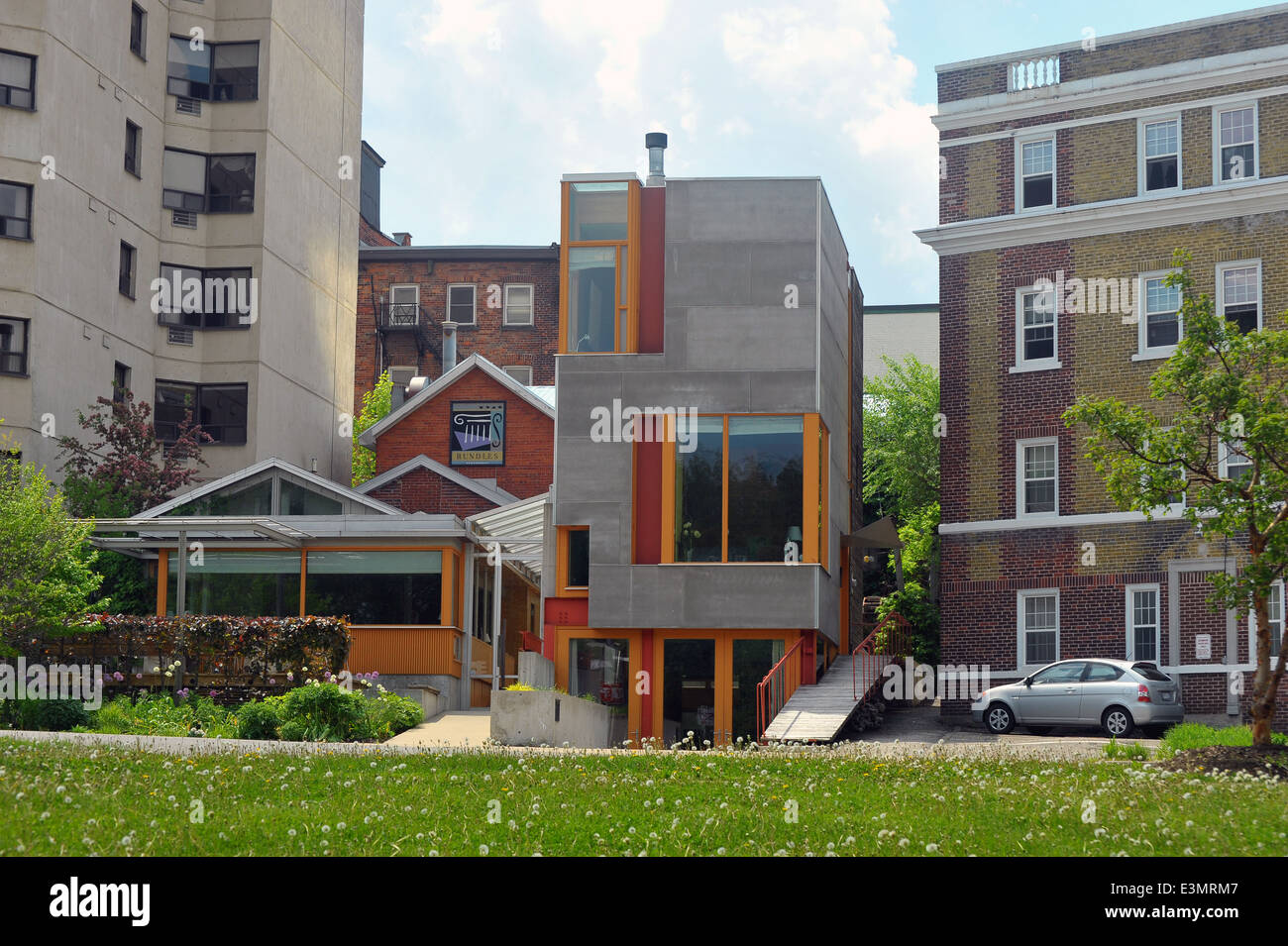 A modern angular building amidst more traditional buildings in ...
