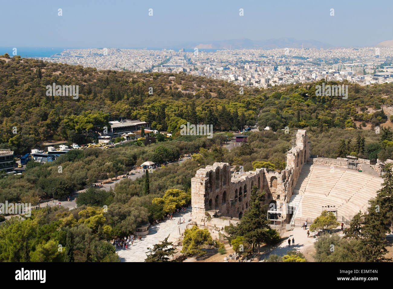 Odeon of Herodes Atticus in Athens with the city of Piraeus in the ...