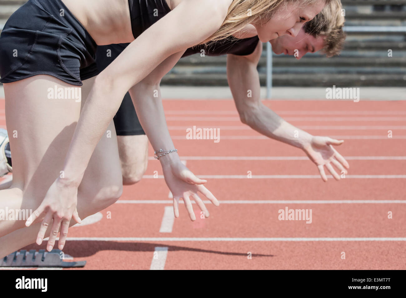 Race of male and female track and field athletes in a stadium Stock ...