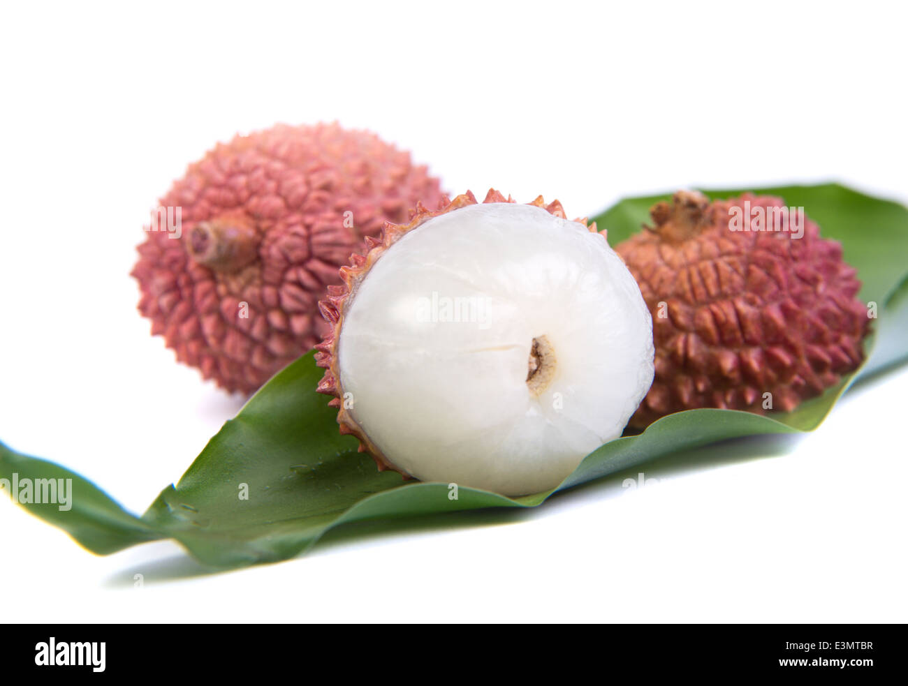 fresh lichees on white background Stock Photo - Alamy