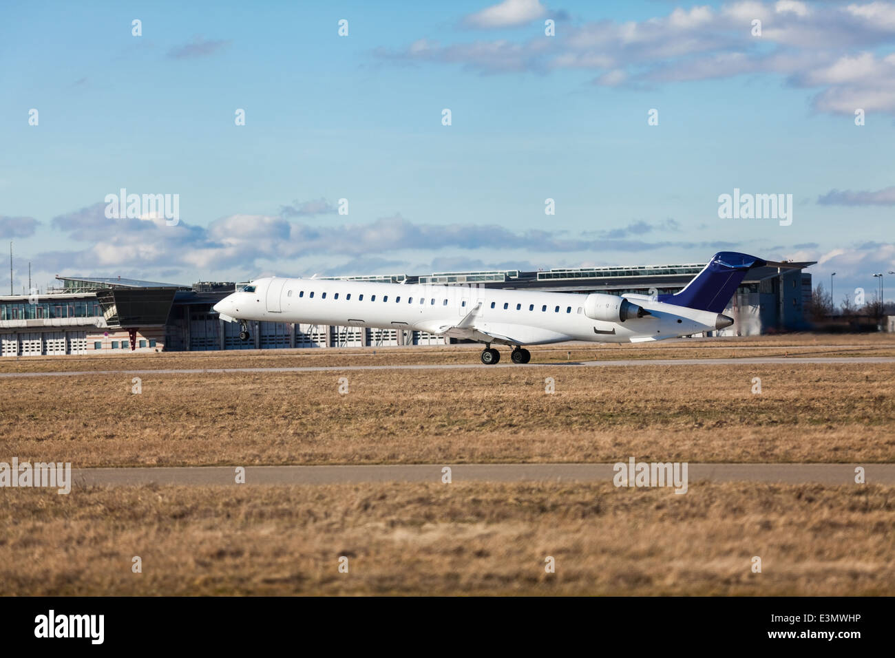 Passenger airliner taking off at an airport lifting clear of the runway ...