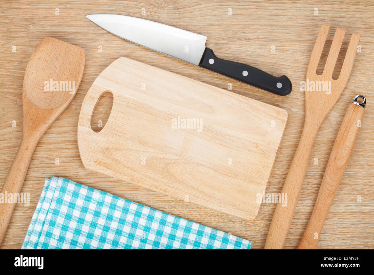 Kitchen utensils on wooden table Stock Photo - Alamy