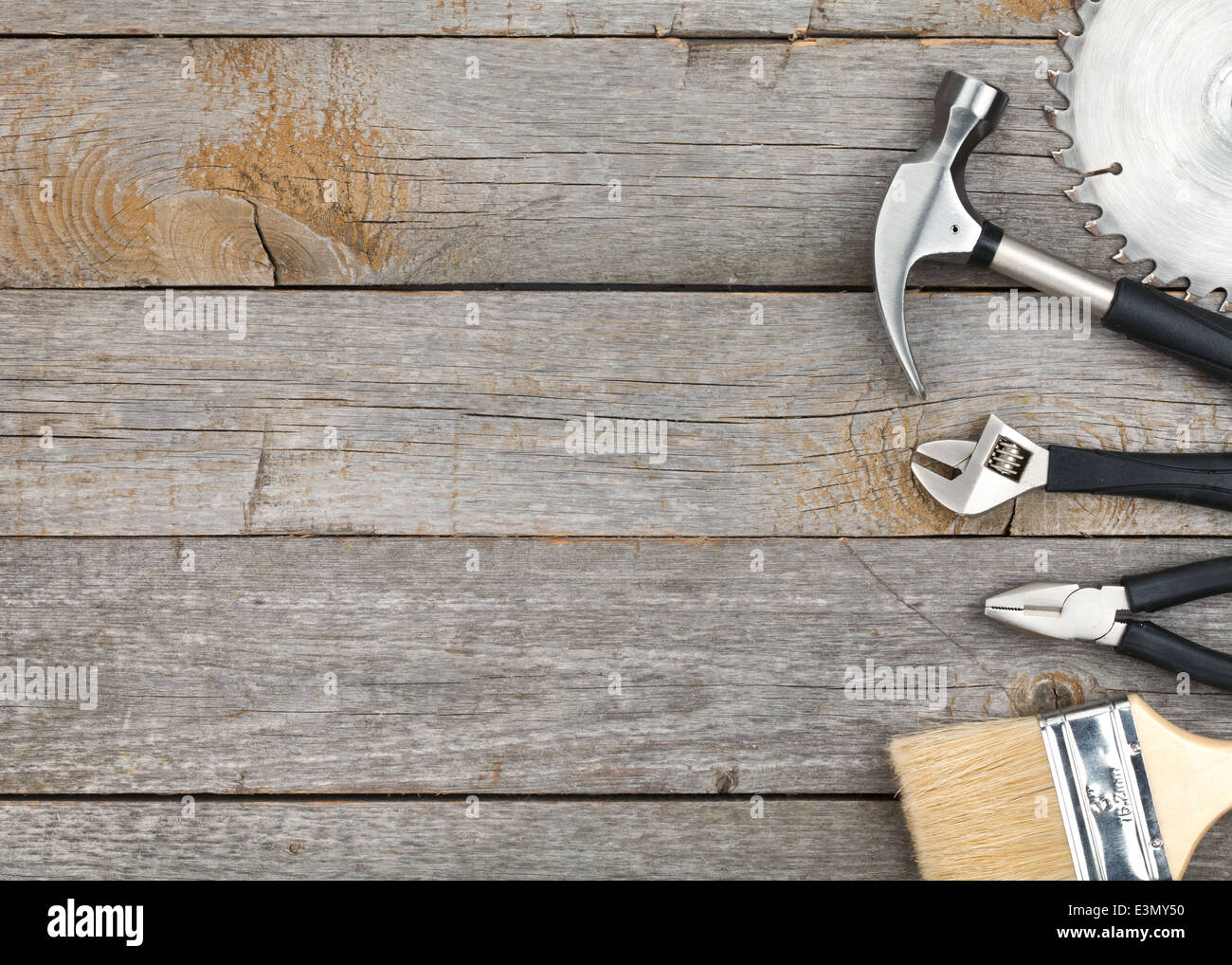 Set of tools on wood panel background with copy space Stock Photo - Alamy