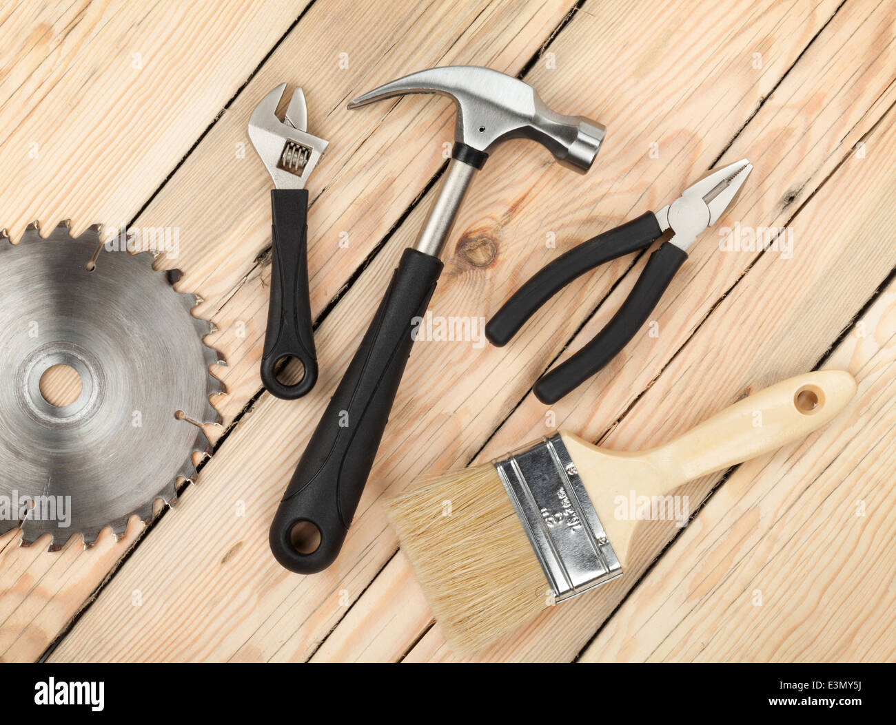 Set of tools on wood panel background Stock Photo - Alamy