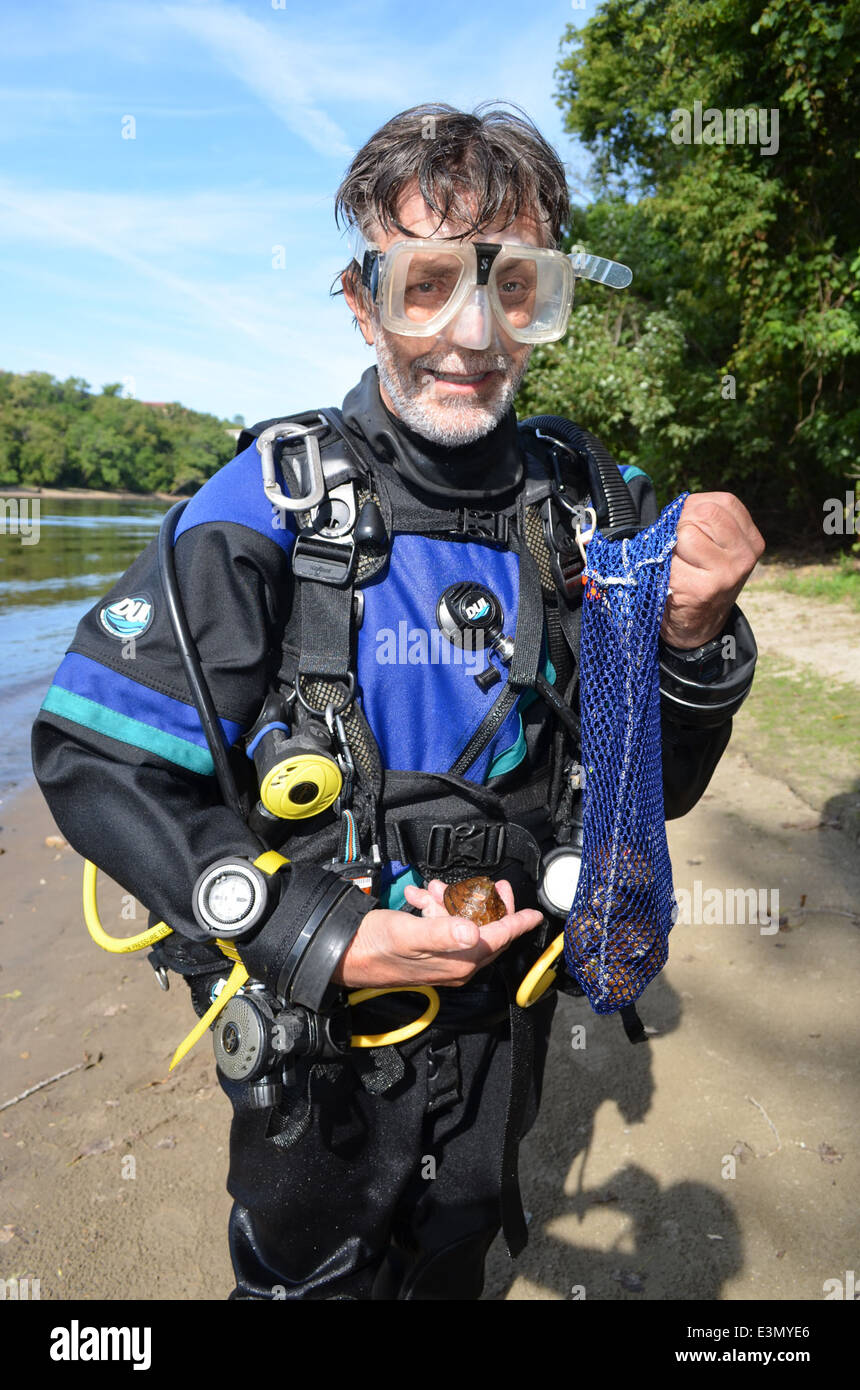 A research diver explores the underwater habitat of endangered species ...
