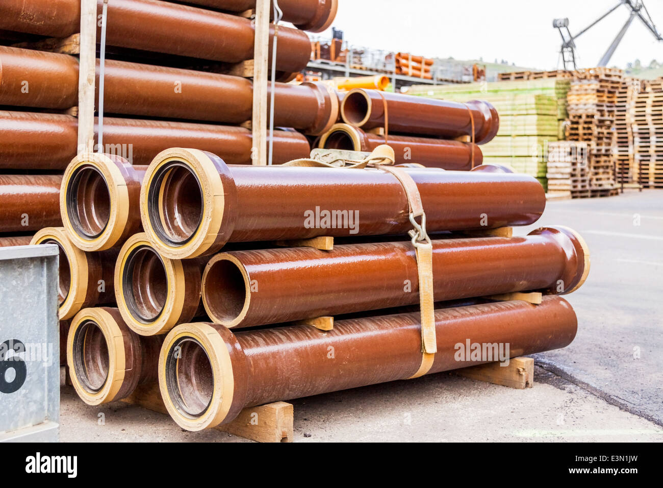 Several pipes in different colors and sizes stacked in yard Stock Photo ...