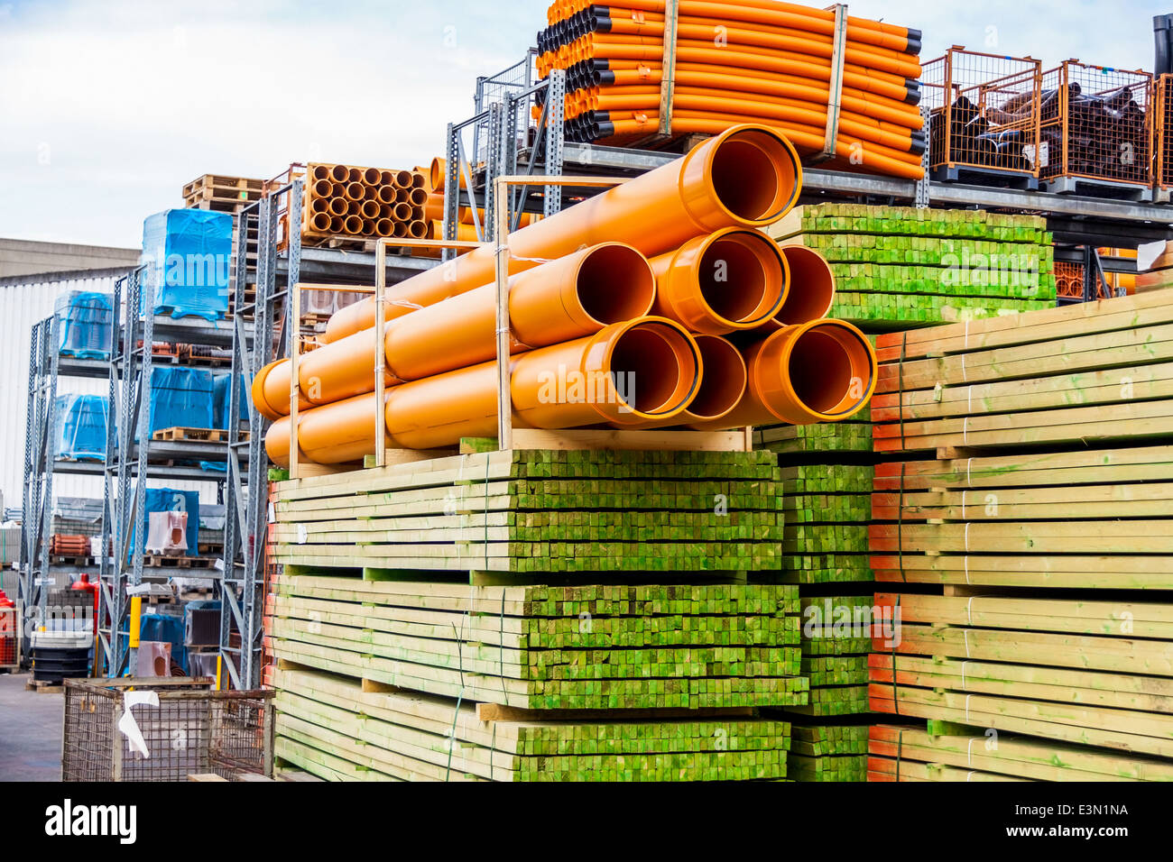 Several pipes in different colors and sizes stacked in yard Stock Photo ...