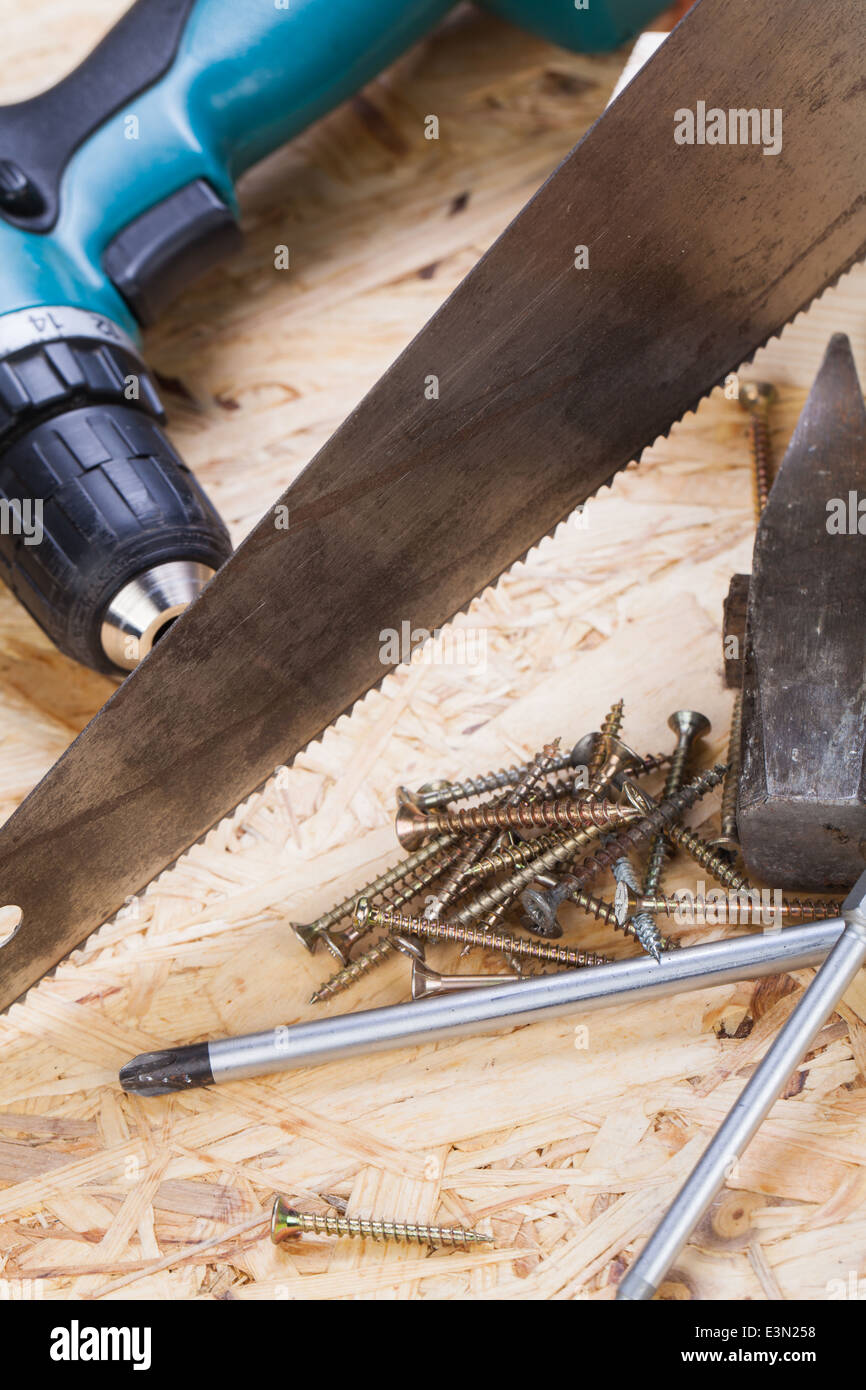 Battery-operated portable hand drill with timber, screwdrivers and ...